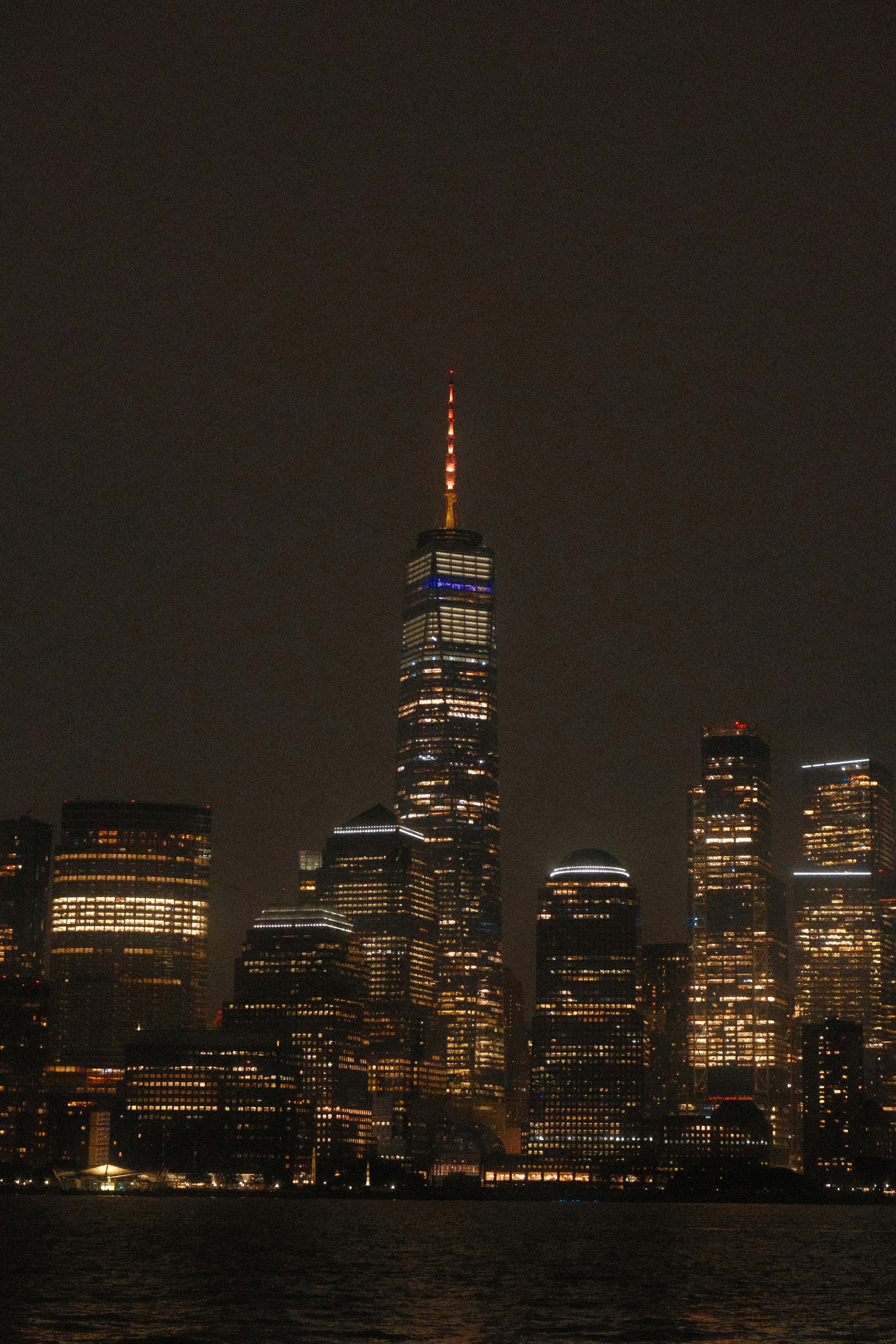 Midnight Empire: City Glow Above the Dark Water