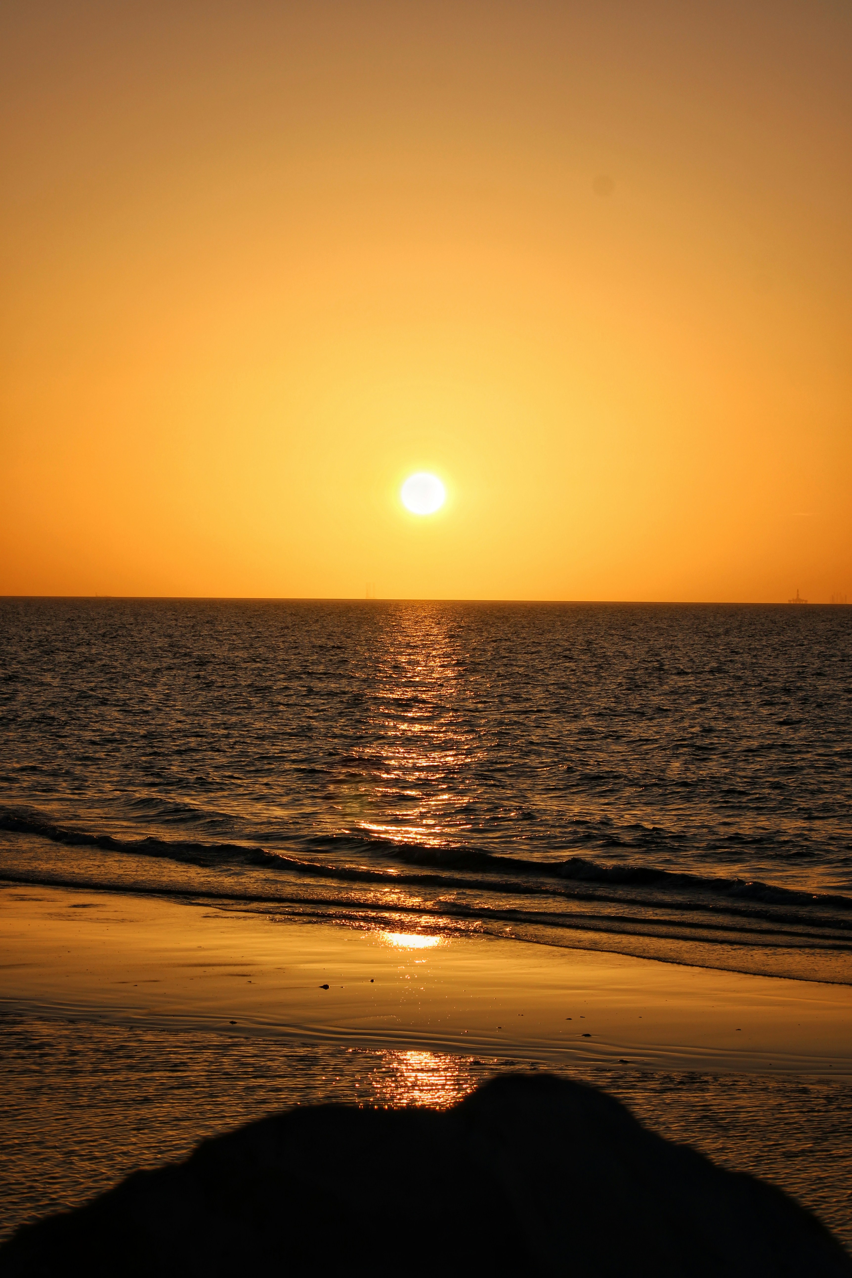 Horizon Lantern: Sunset Over Quiet Waves