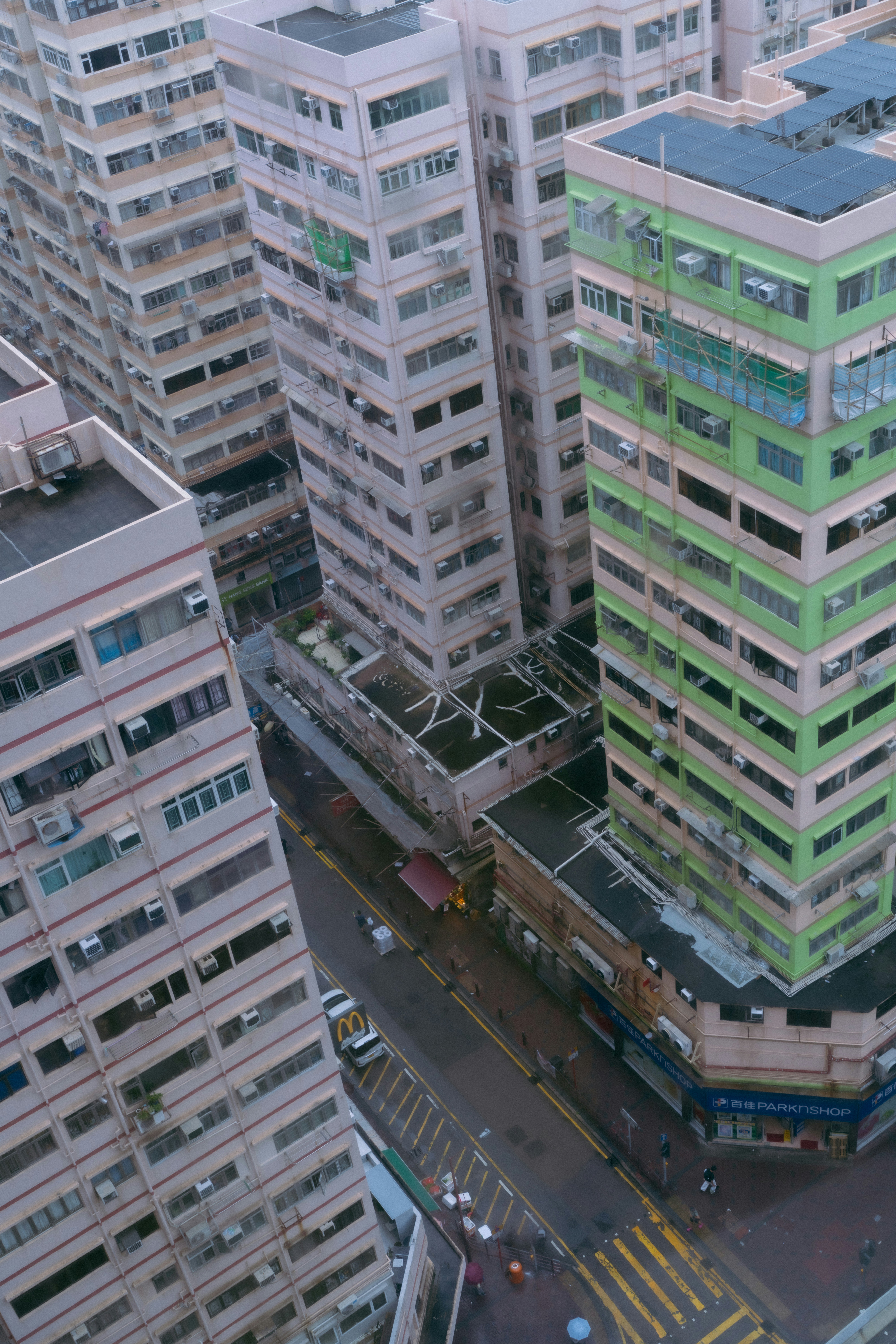 Urban Canyon: Aerial View Between Neon-Trimmed Towers