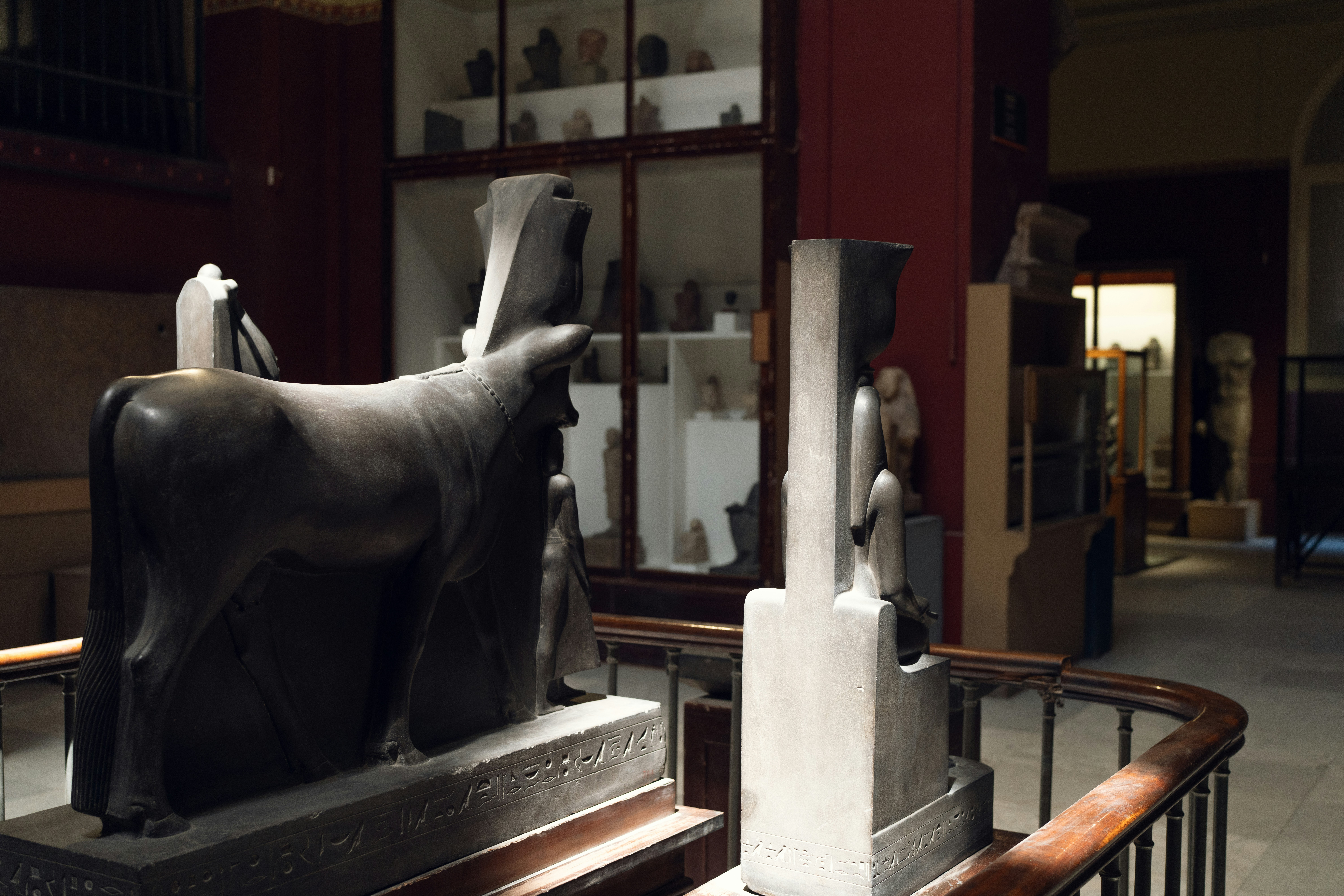 Silent Gallery: Sculptures in a Dim Museum Corridor