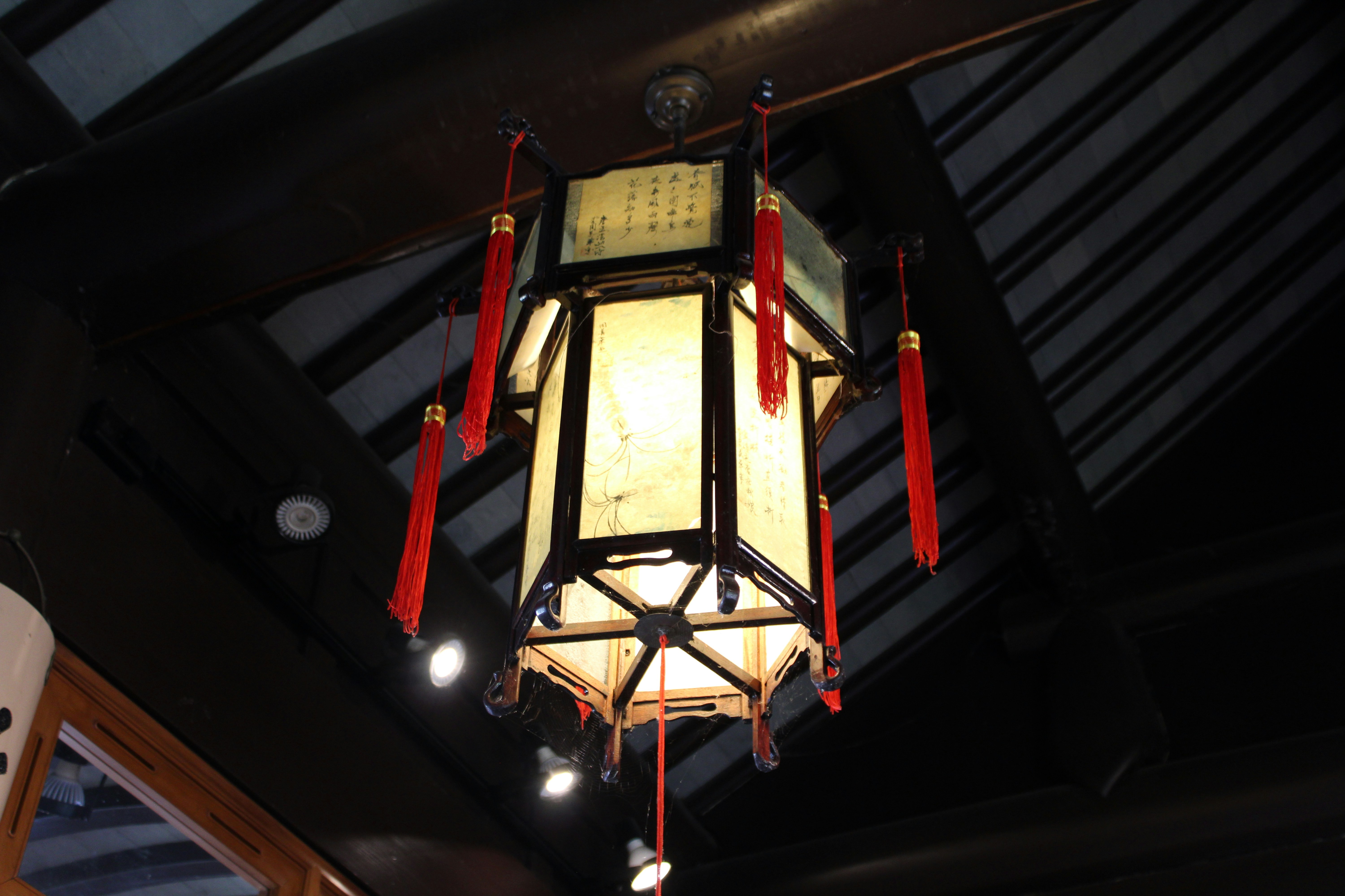 Hung Lantern Glow: Chinese Lanterns Illuminating a Dark Ceiling