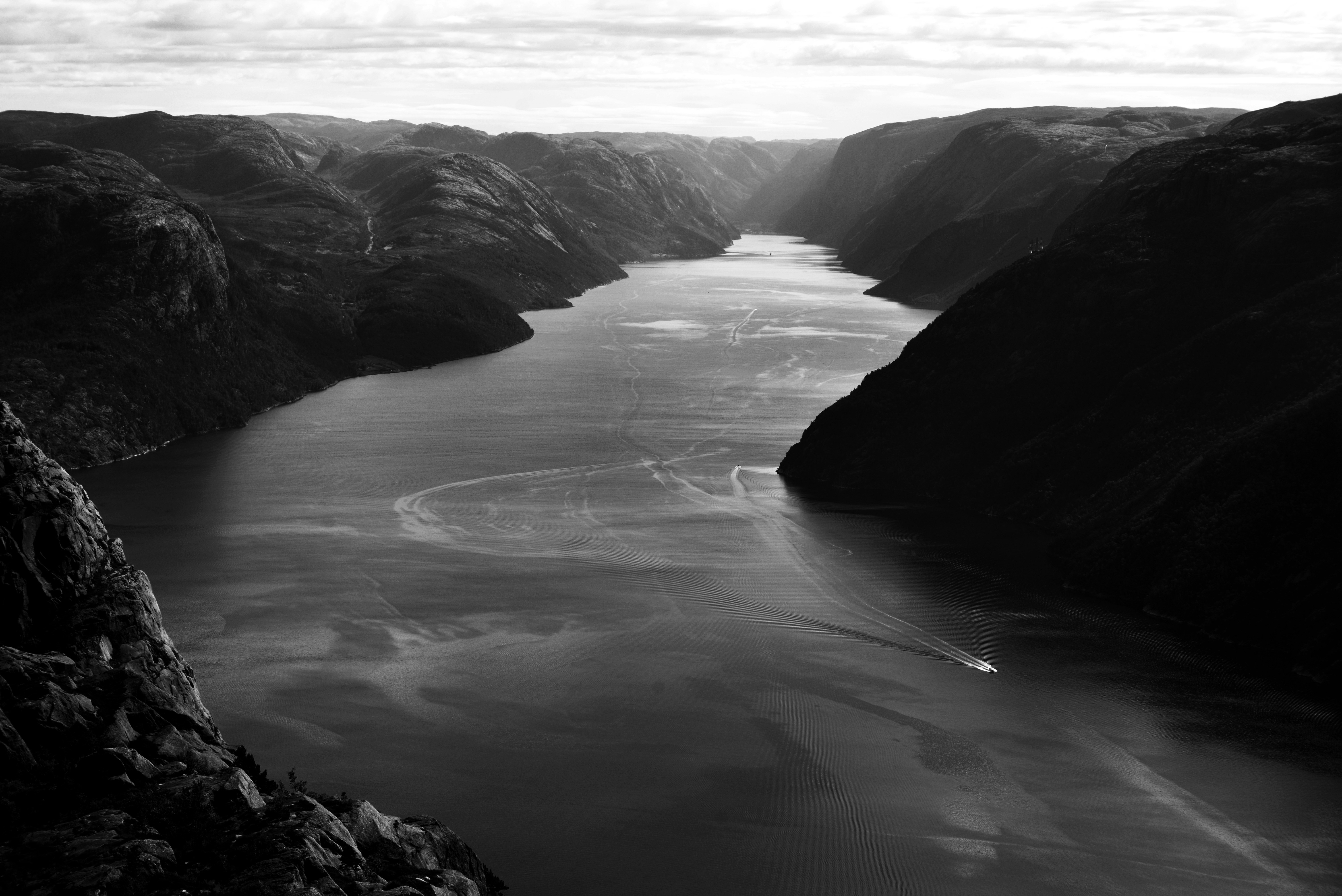 Shadowed Fjord: A Monochrome Corridor Through Evening Water
