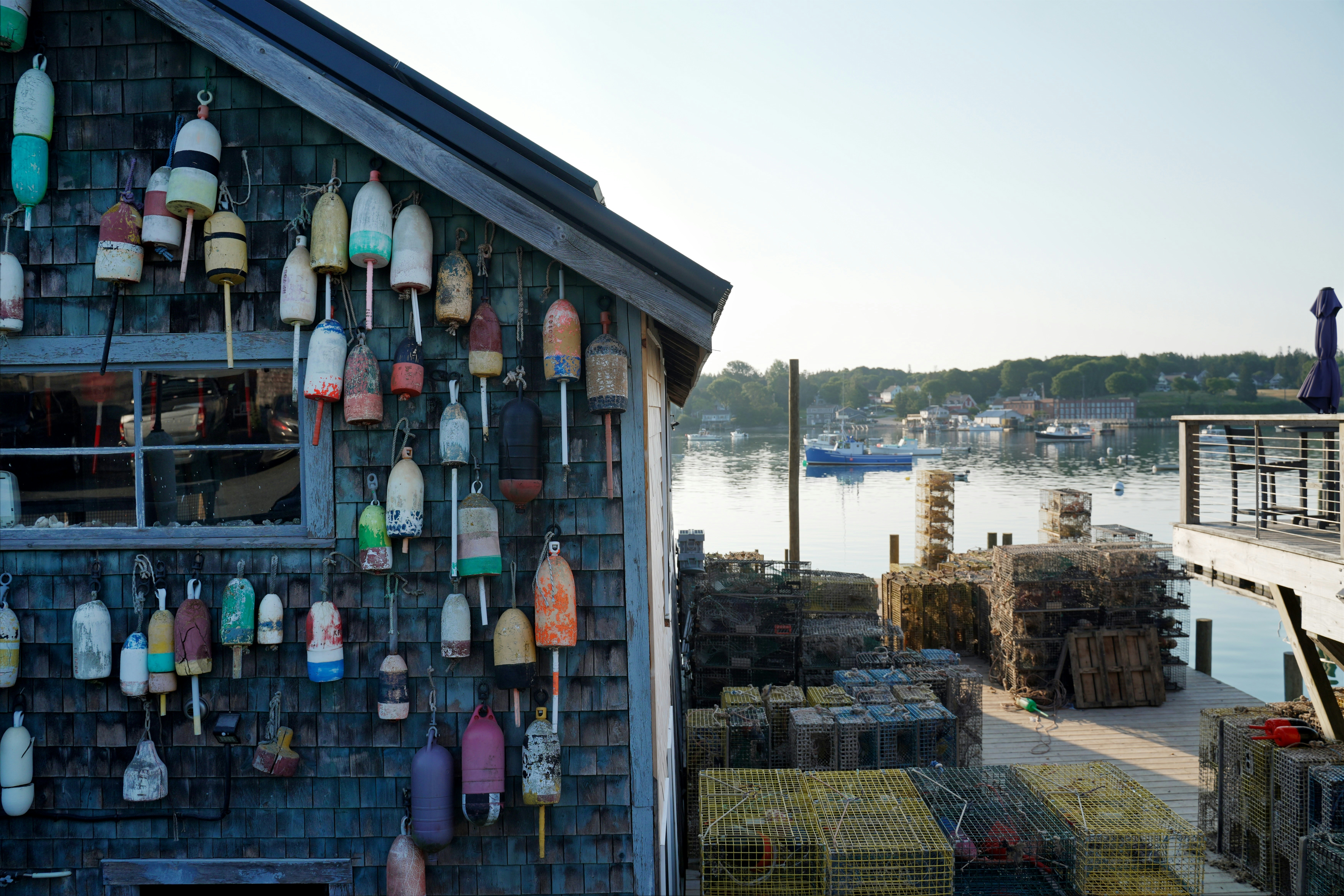 Buoyant Buoys by the Docks: A Sunlit Shingle Facade