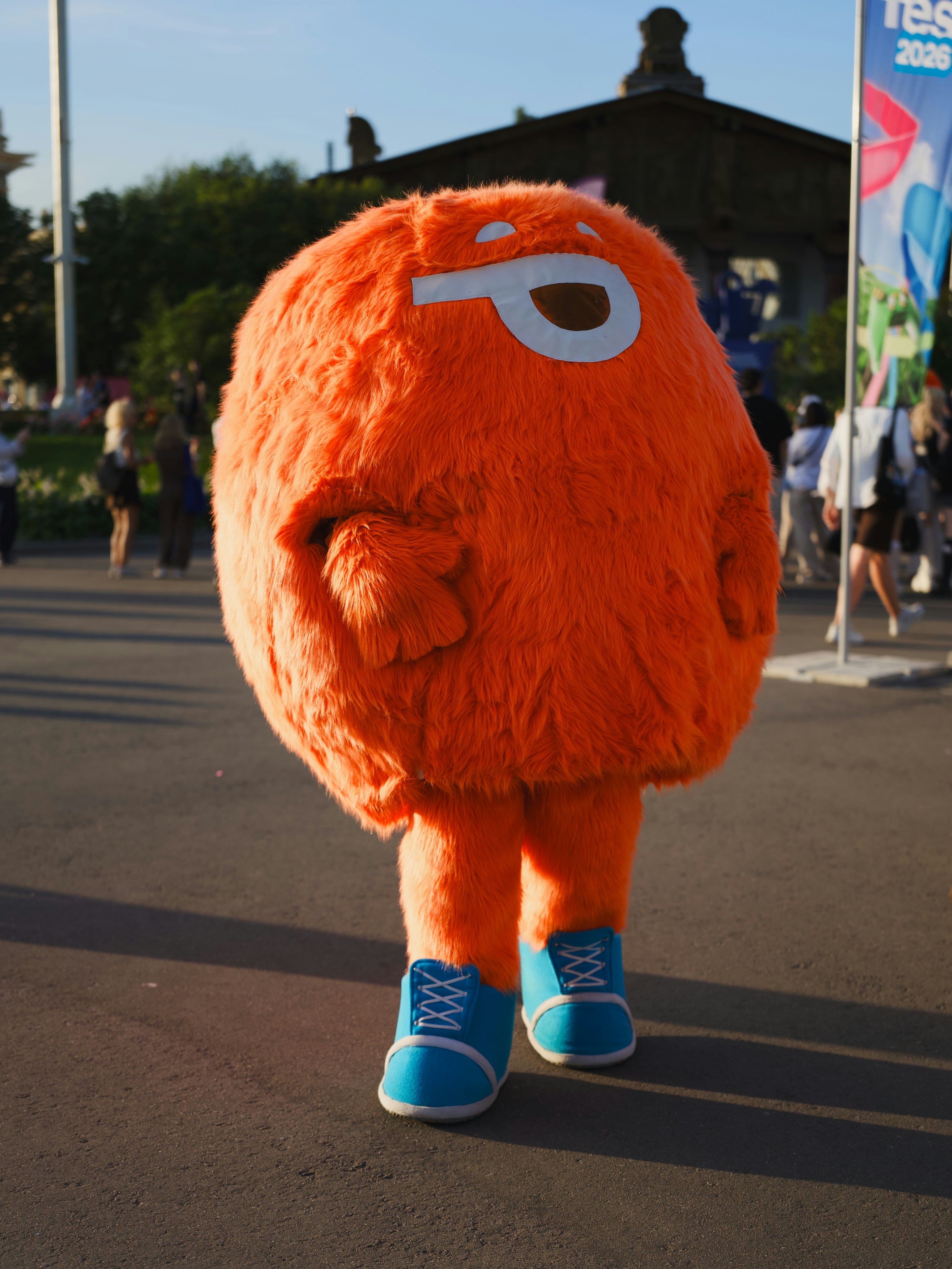 Orange Furball at the Parade: A Walkable Character in Blue Sneakers