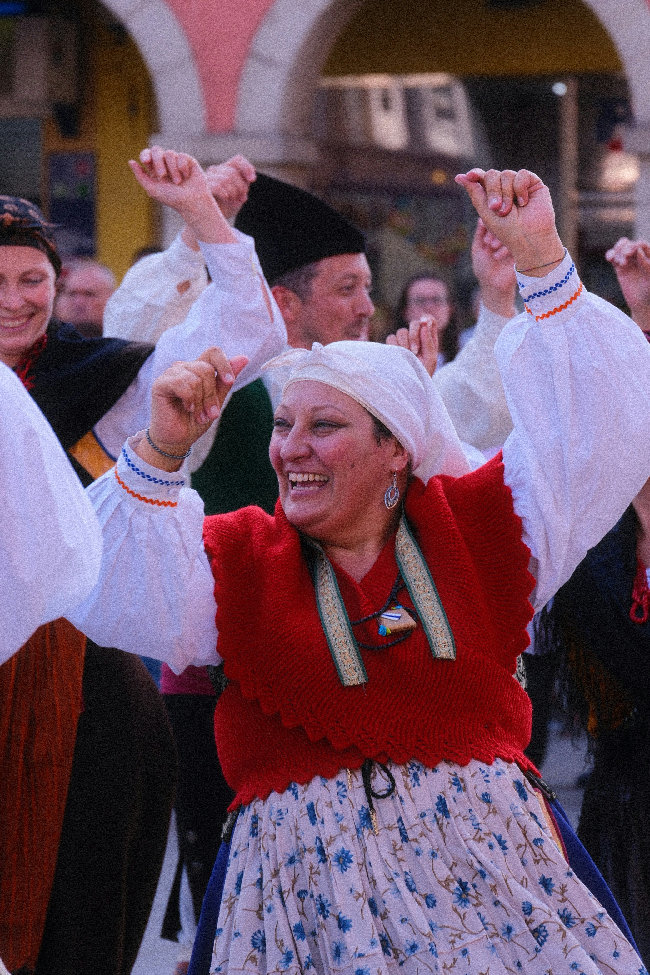 Joyful dance in traditional dress during a festive street performance