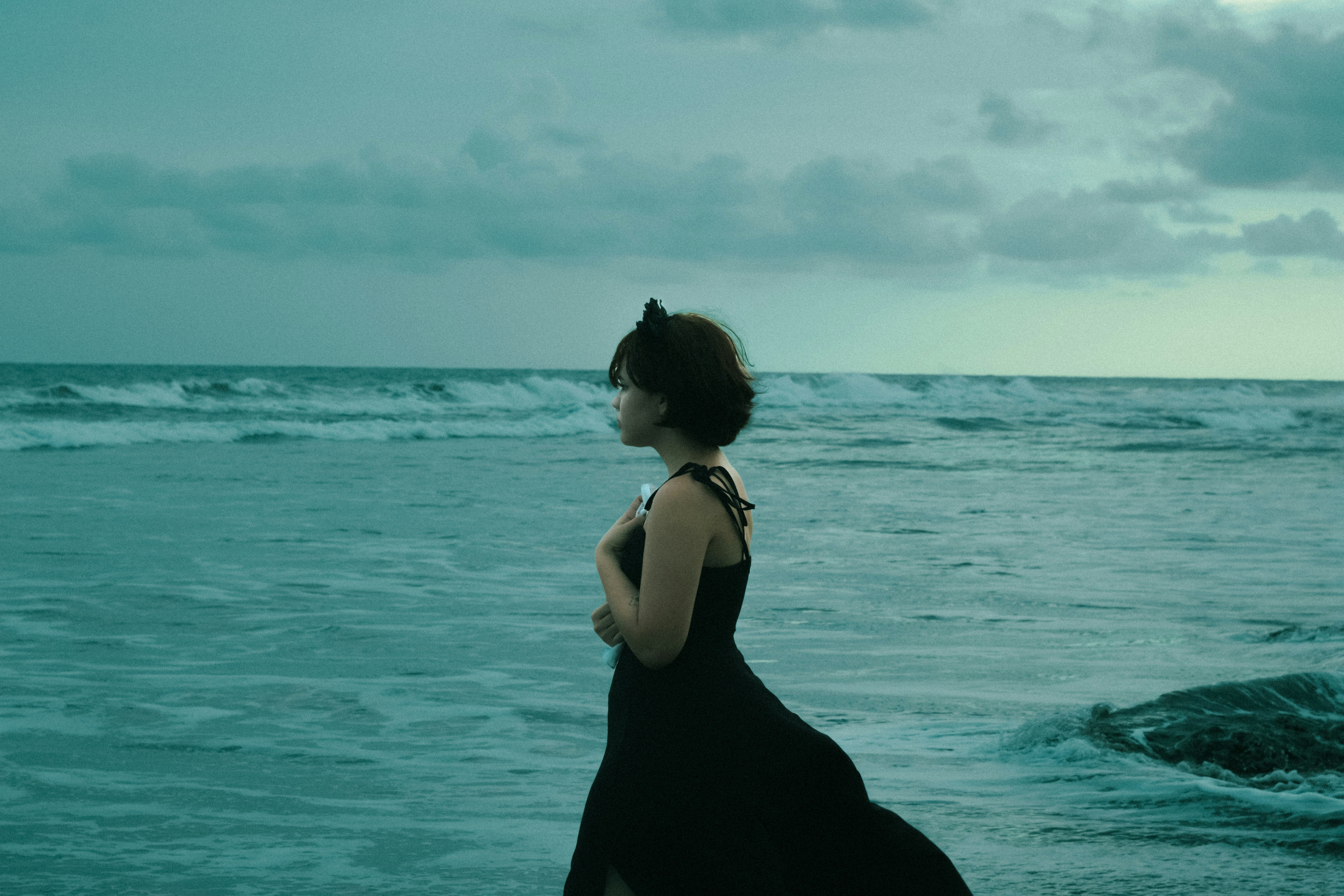 Hushed Portrait at Twilight: A Silhouette in the Surf