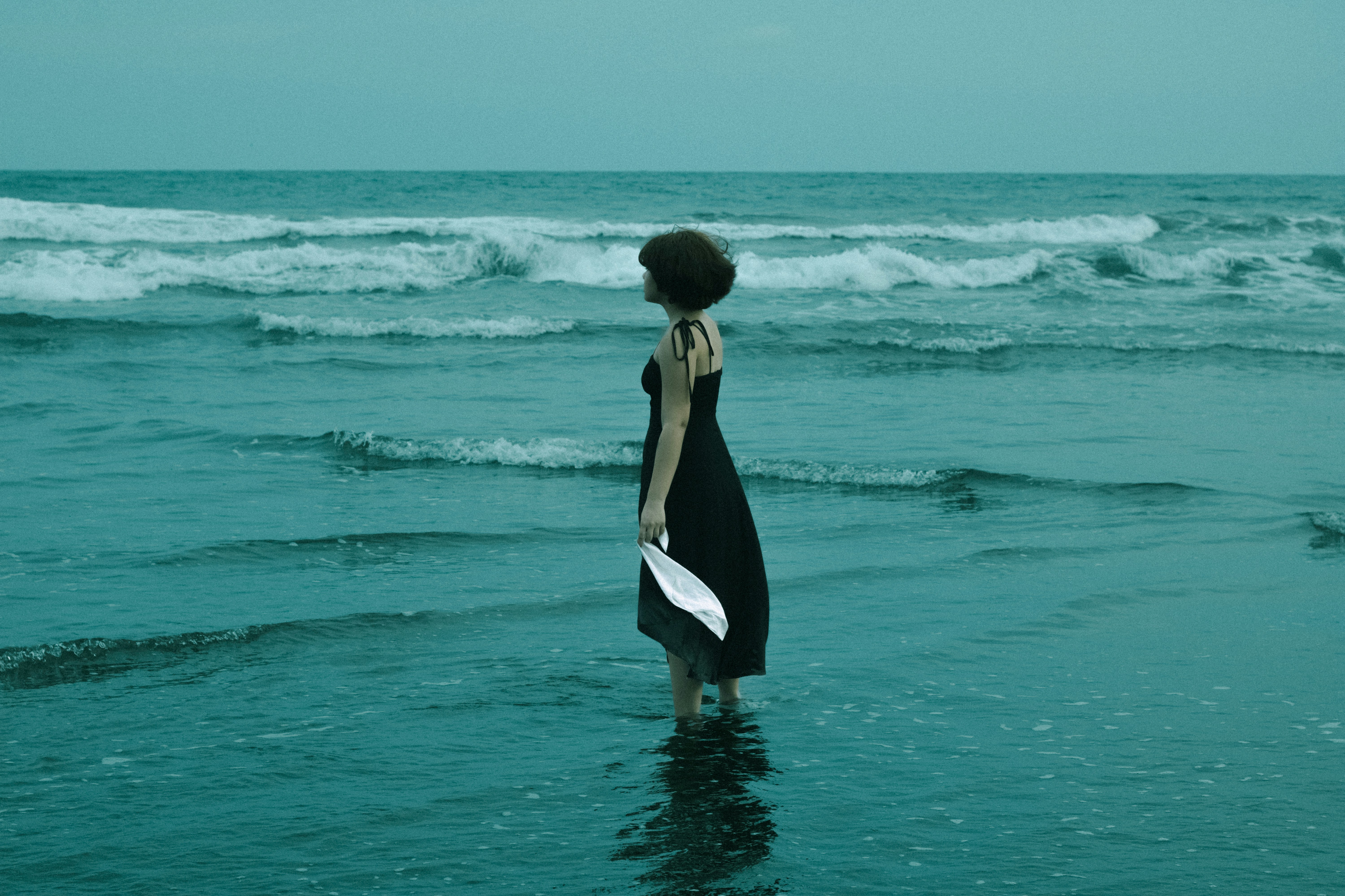 Solitary Seaside Silhouette in Evening Tide