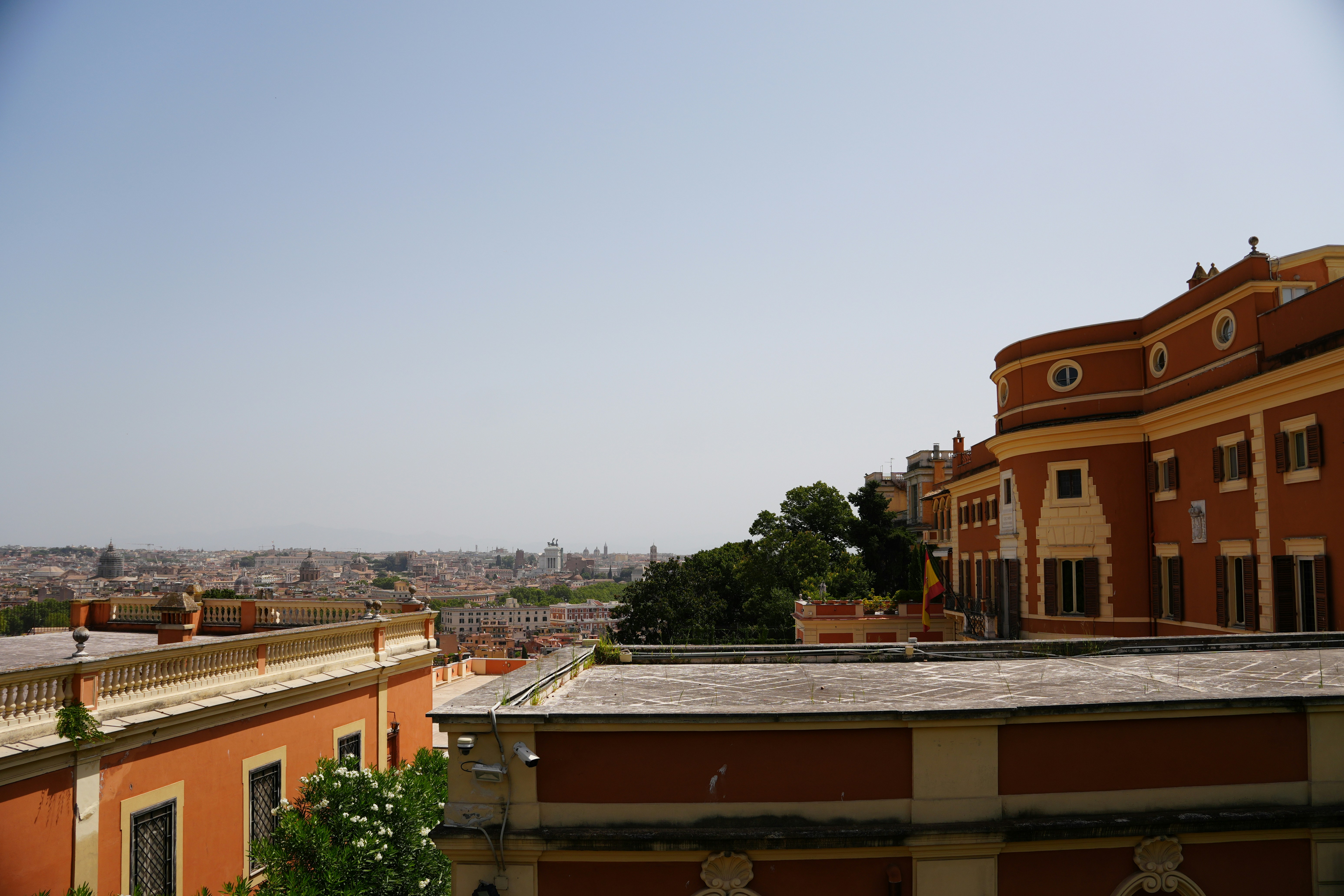 Terracotta Rooftops toward a Sundrenched Cityscape