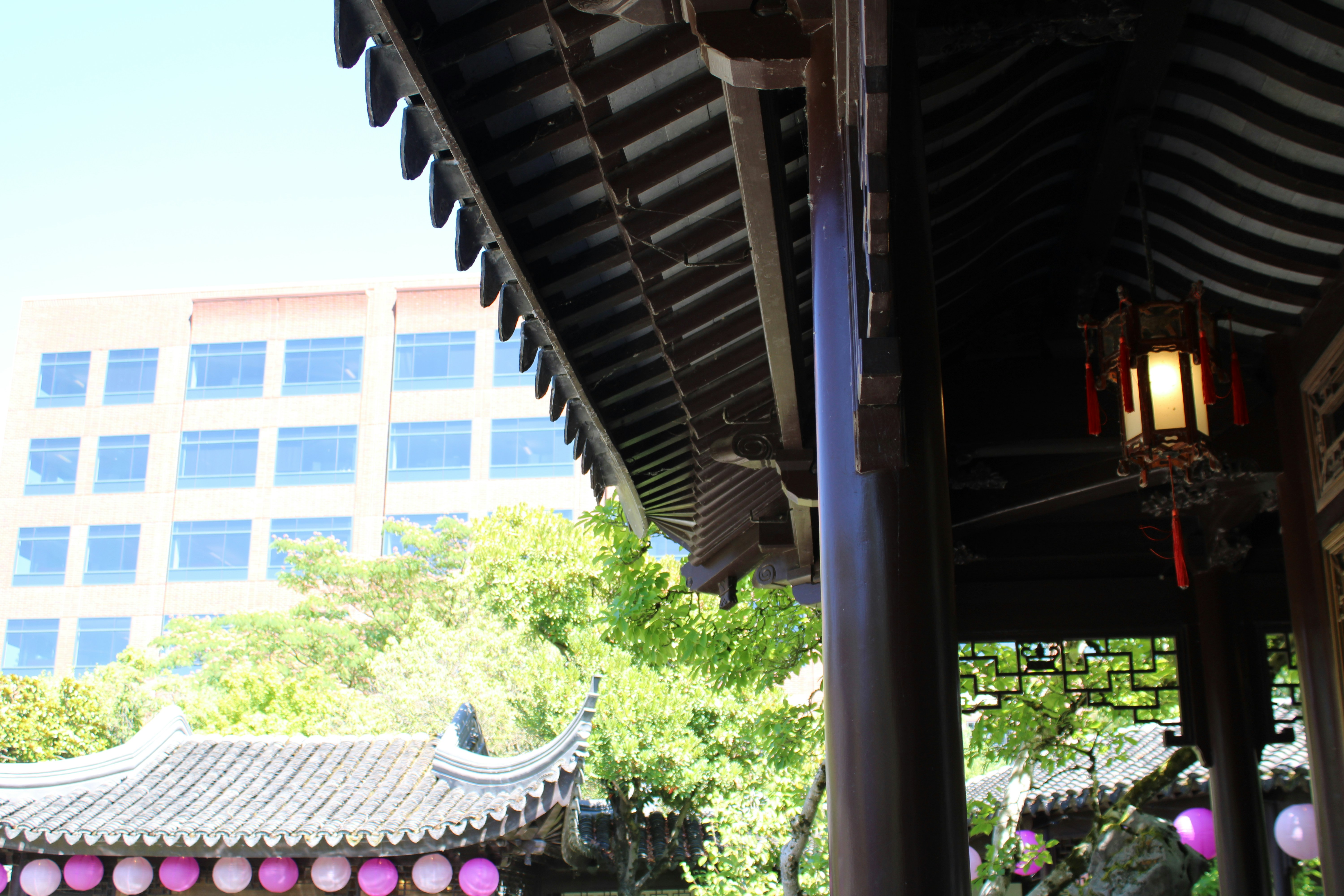 Temple Eaves and Lanterns Frame the Modern Courtyard