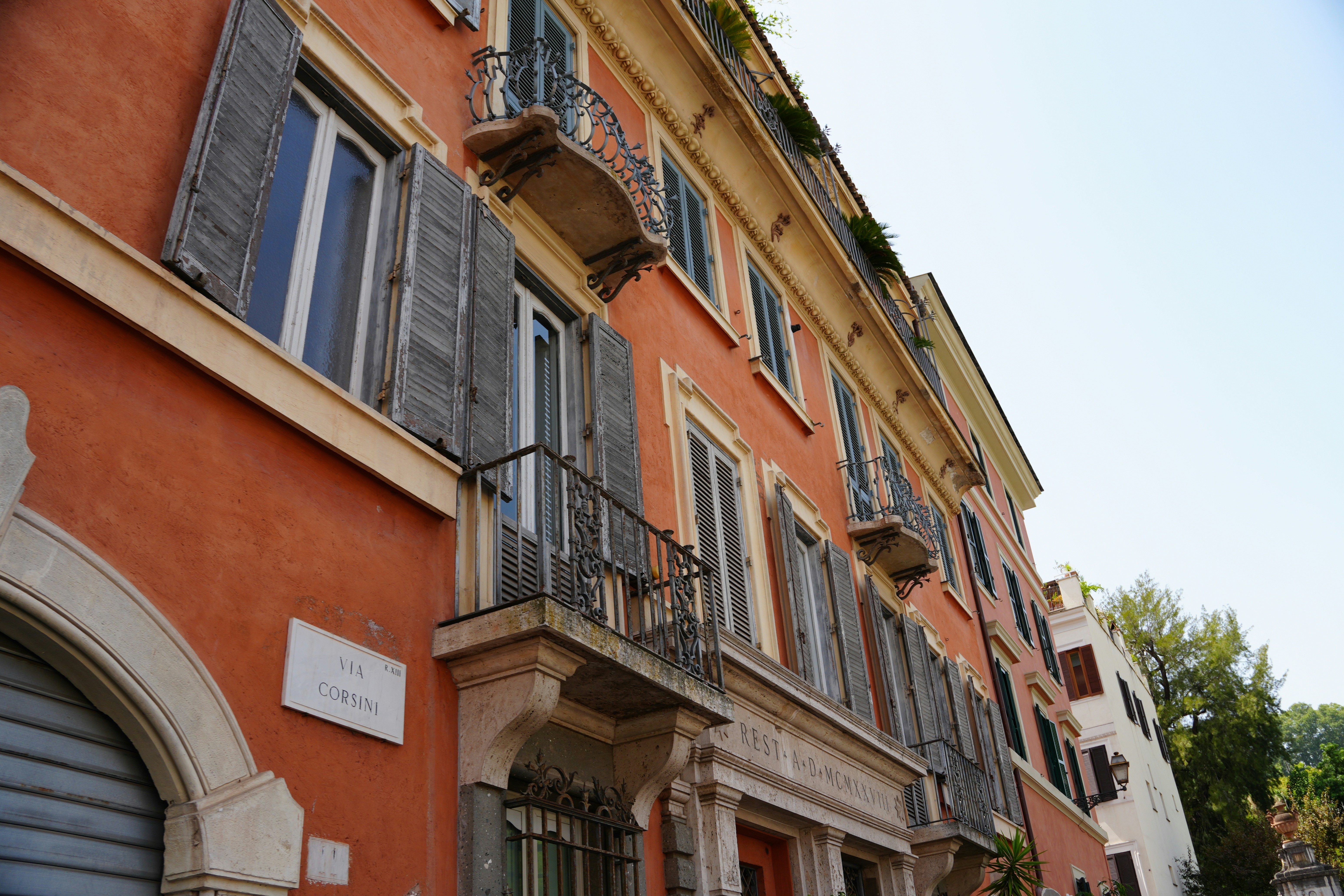 Terracotta Facade Street: Balcony Echoes under a Sunny Sky