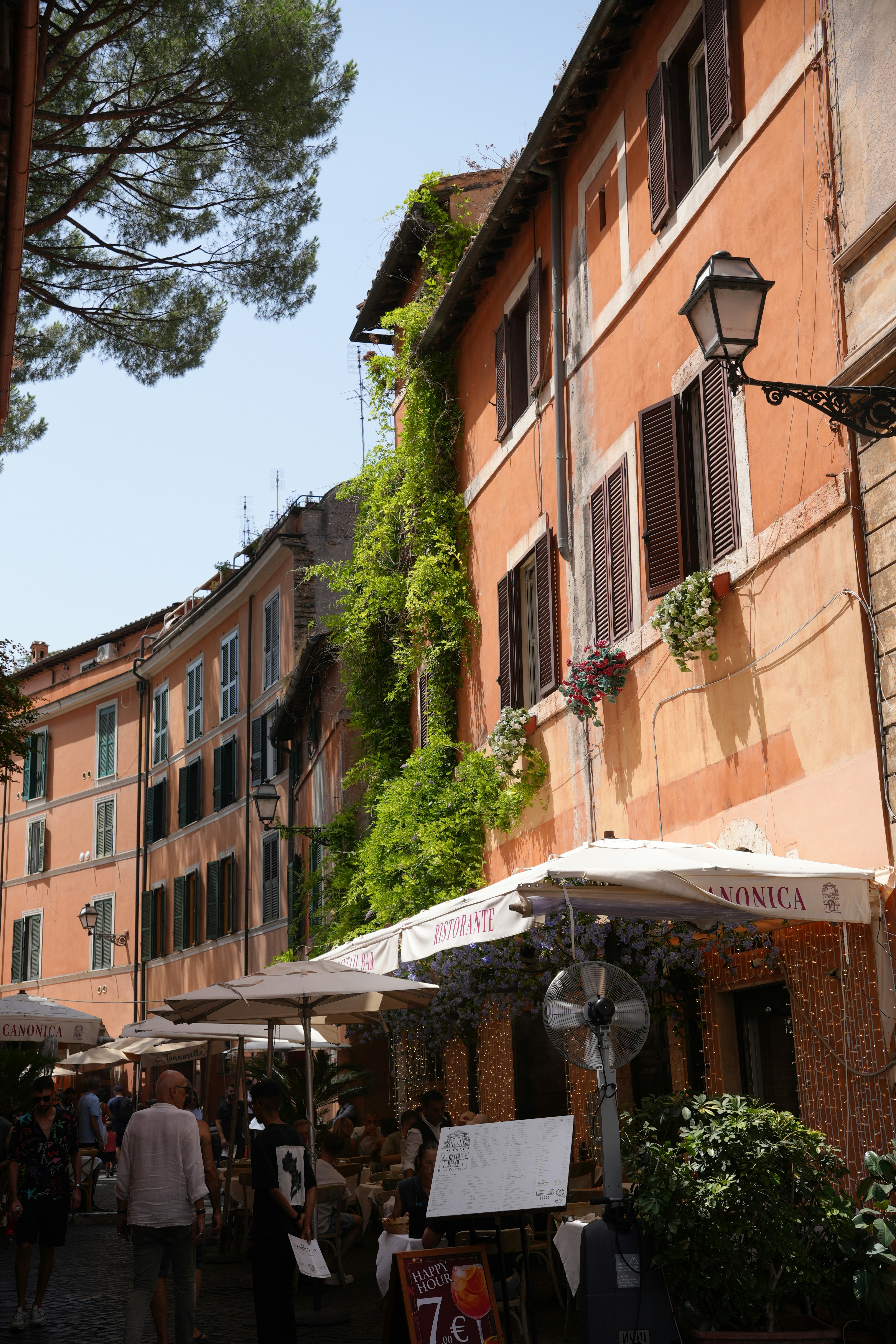 Sunlit Italian Alley: Coral Facades, Lanterns, and Café Echoes