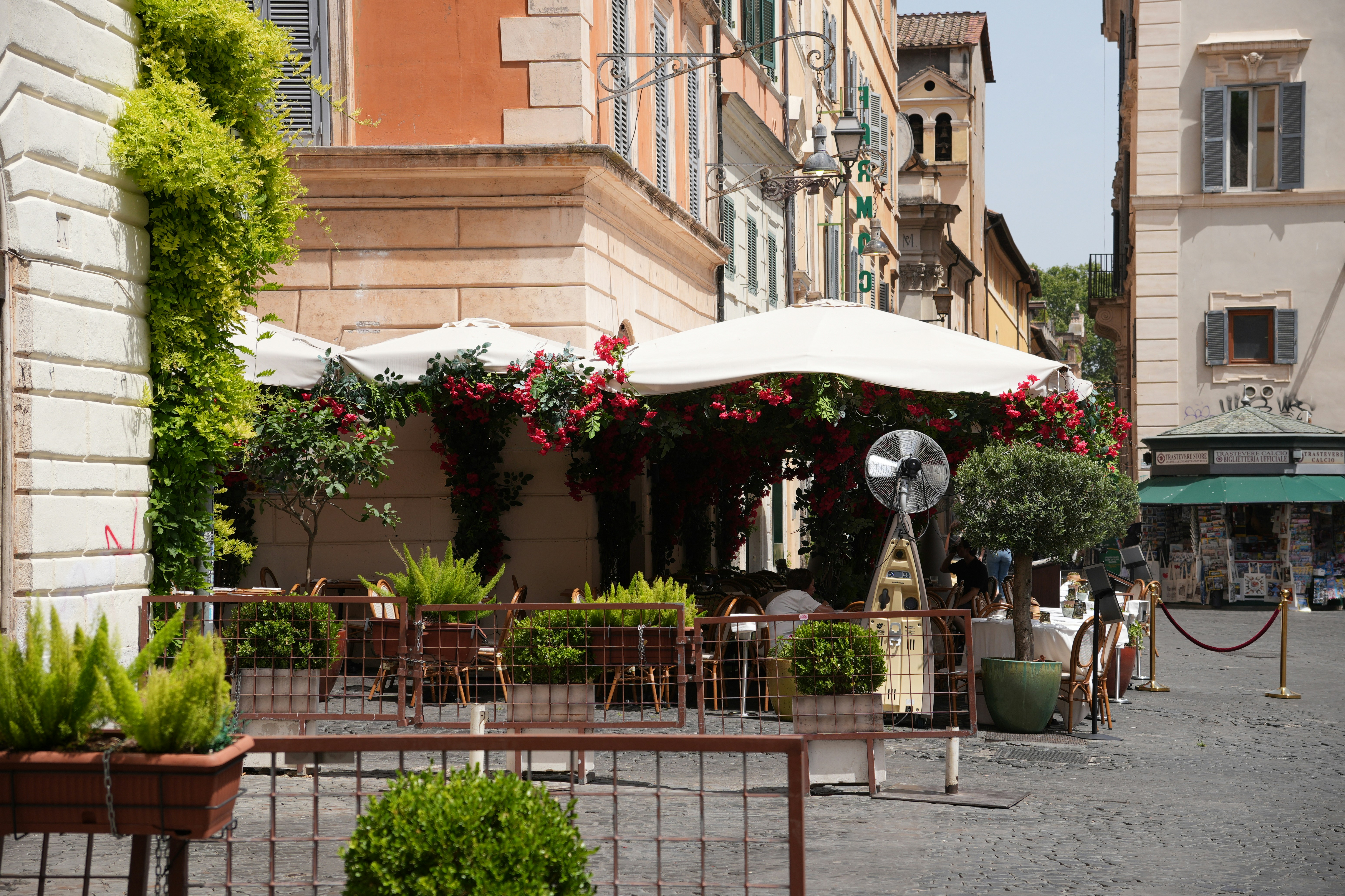 Sunlit Café Terrace on a European cobblestone Lane
