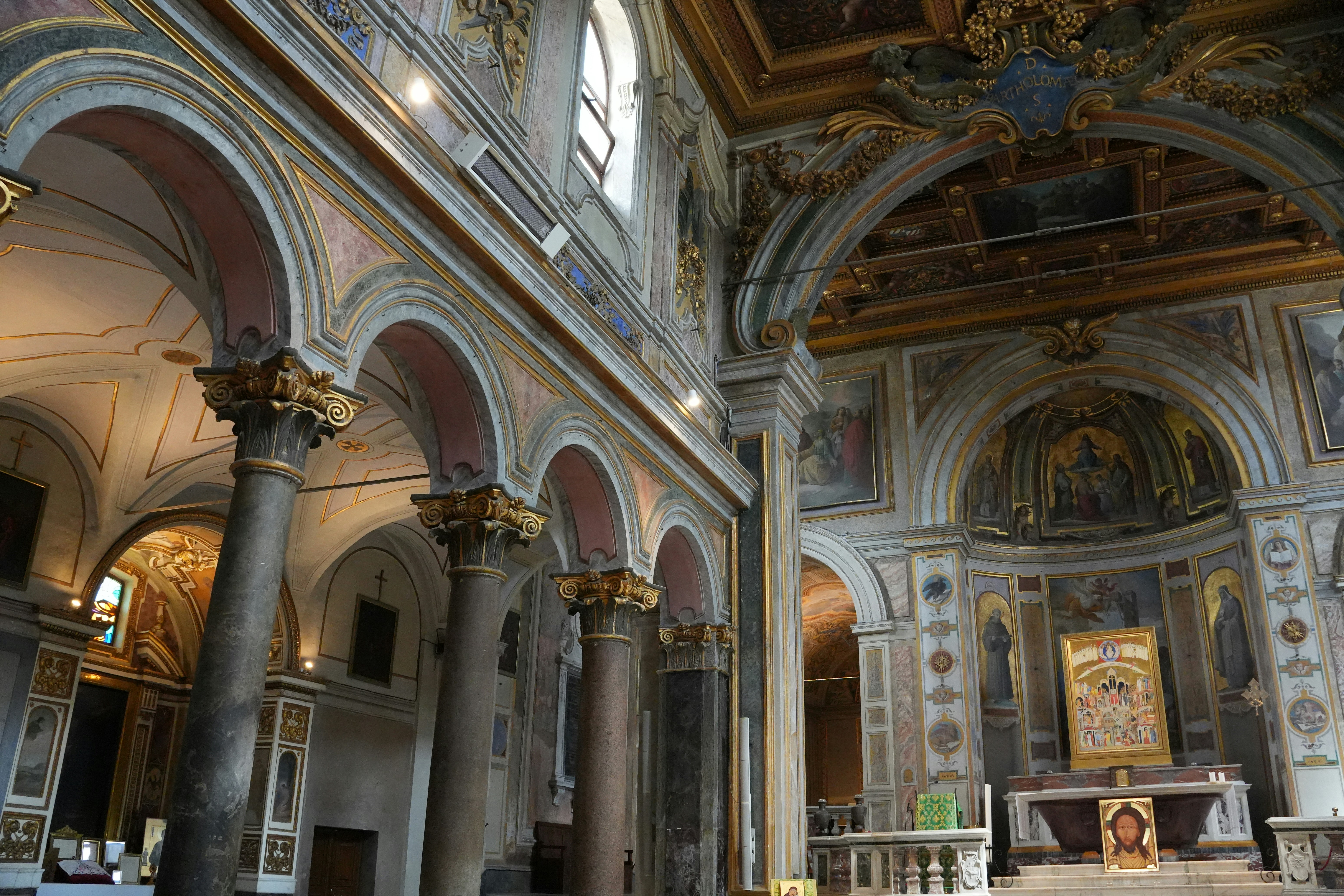 Sacred Atrium: Archways, Frescoes, and Altars in a Baroque Church Interior