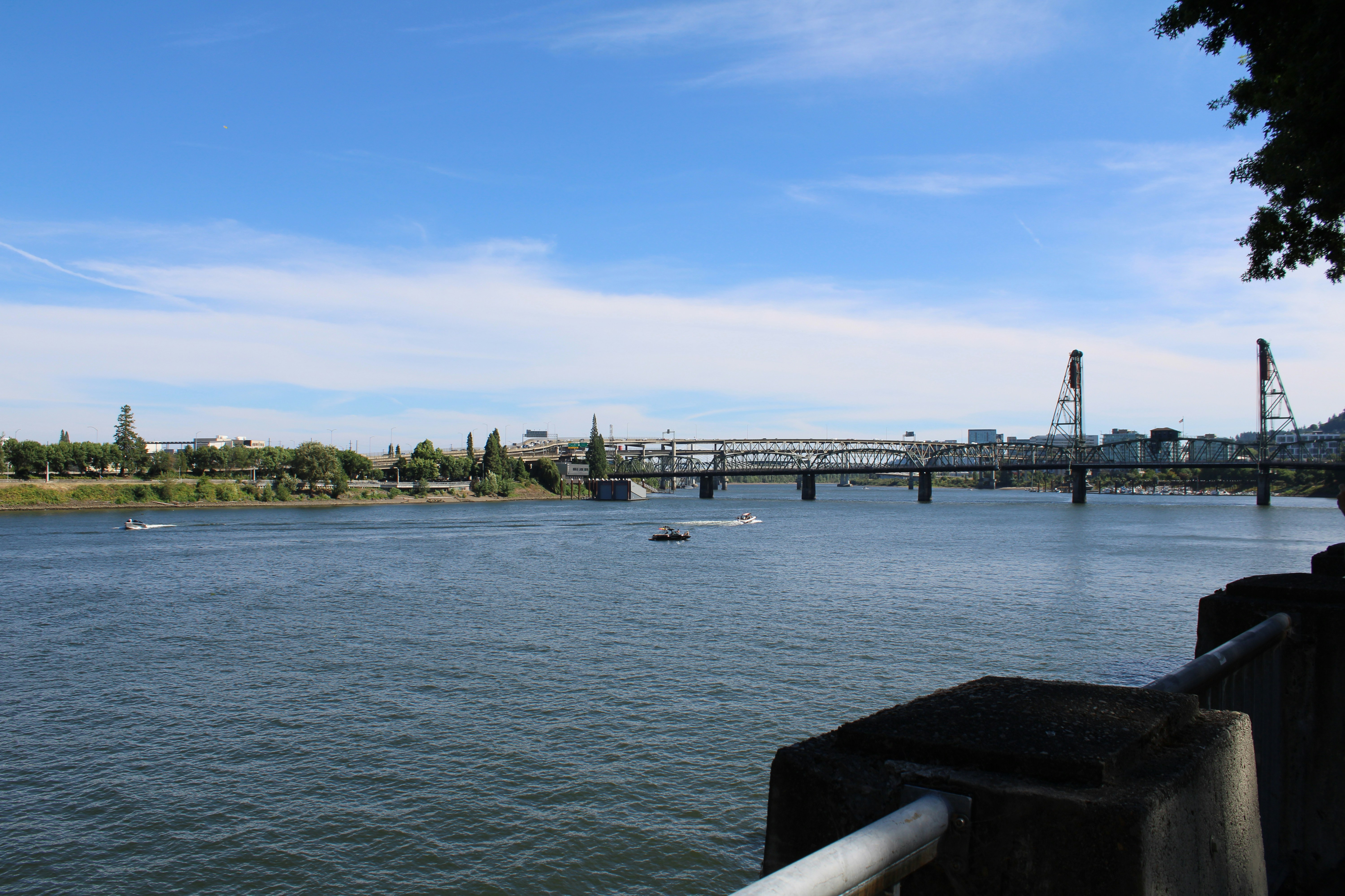 Across the River: A Quiet Cityscape Beneath a Wide Sky