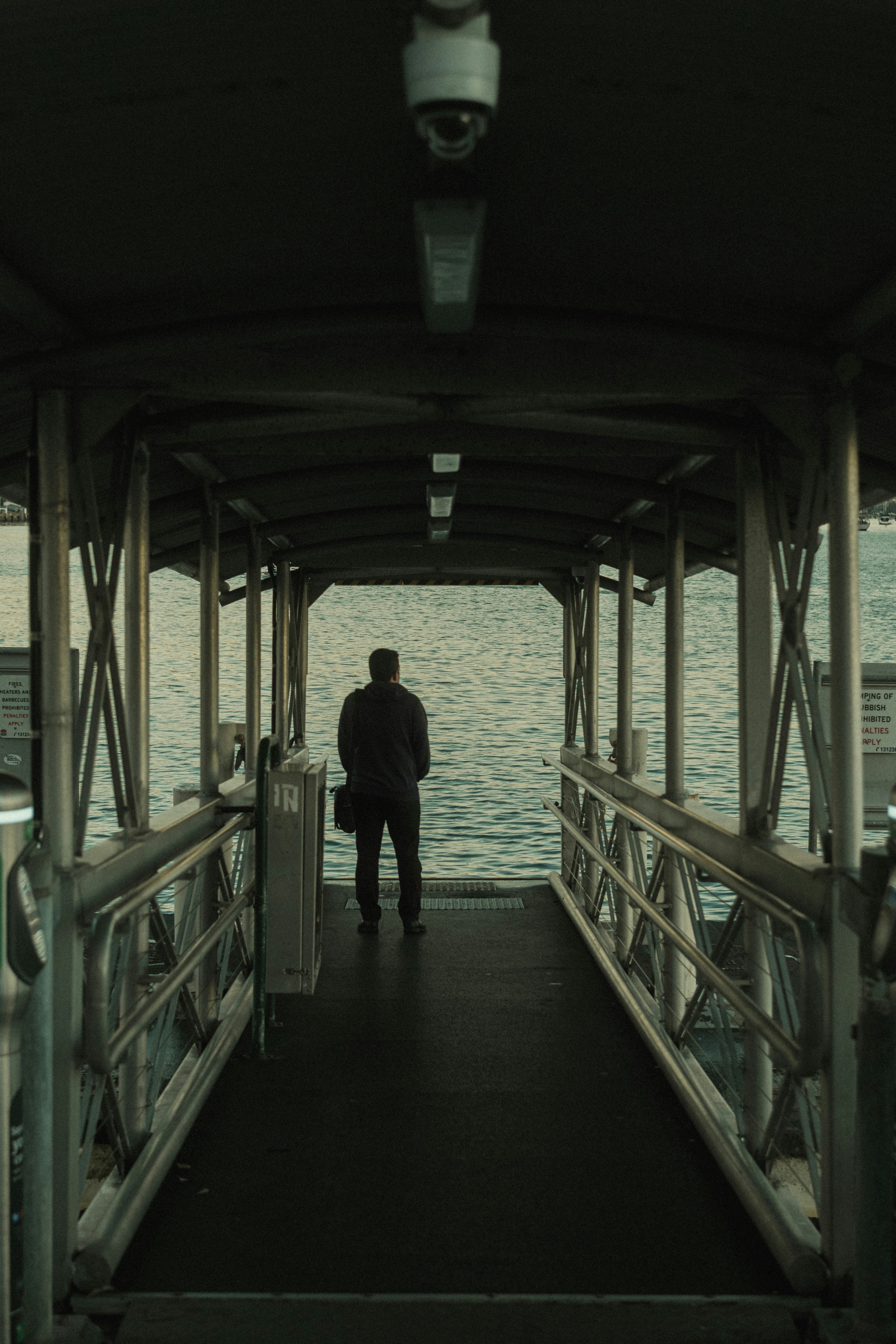Solitary Figures at the End of the Pier