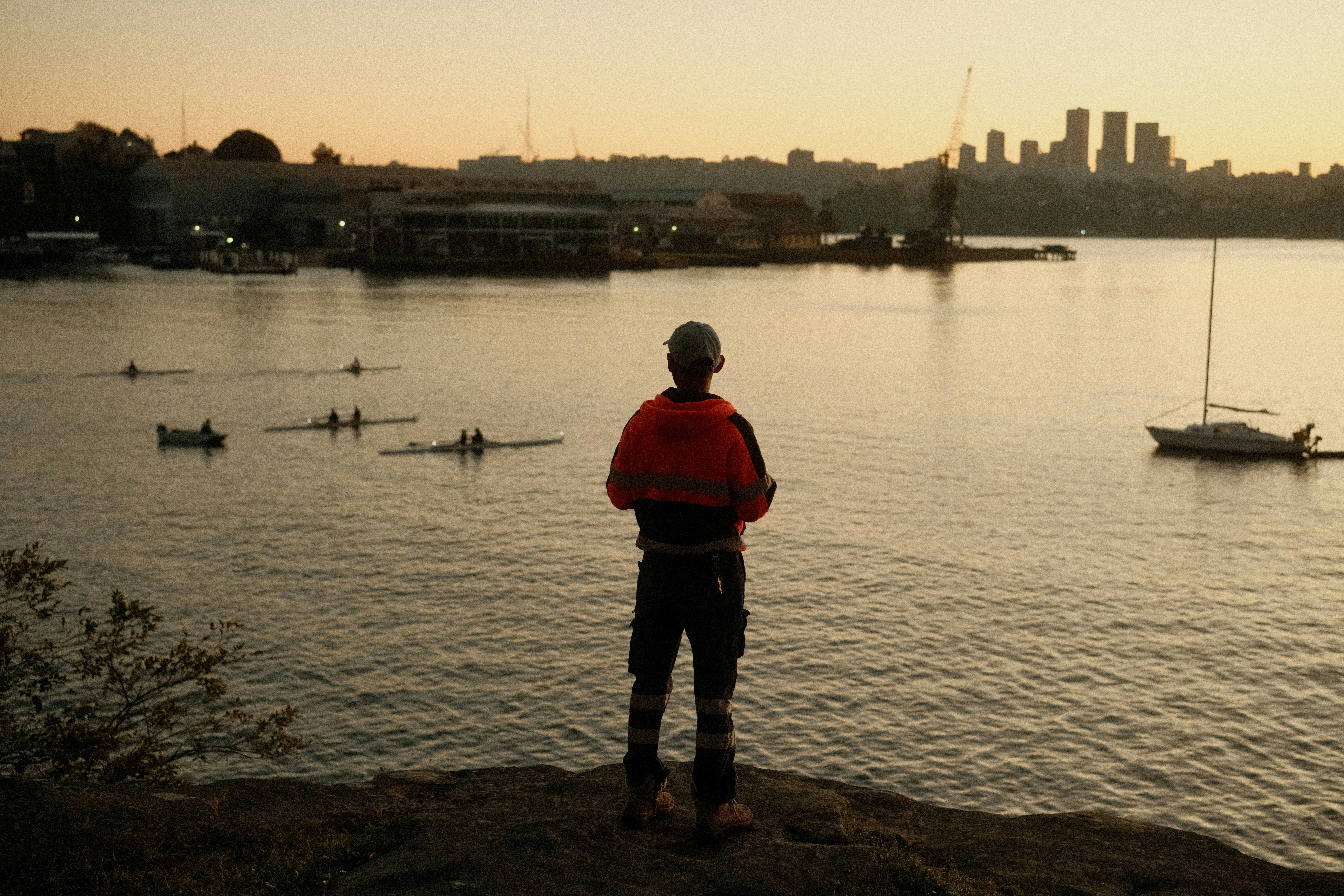 Silhouette at Sunset: A Waterfront Sentinel