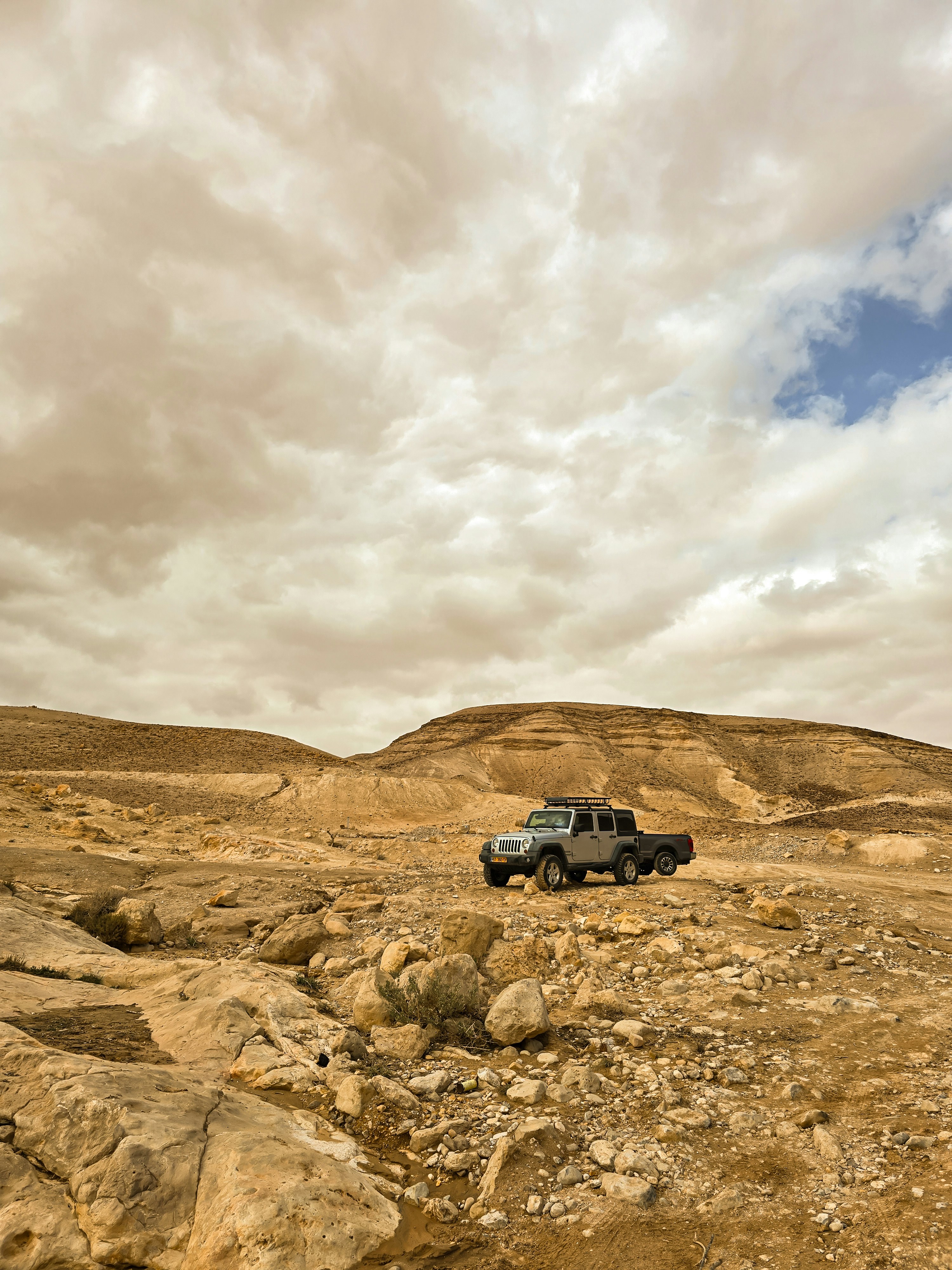 Desert Vehicle at the Edge of a Rough Plateau