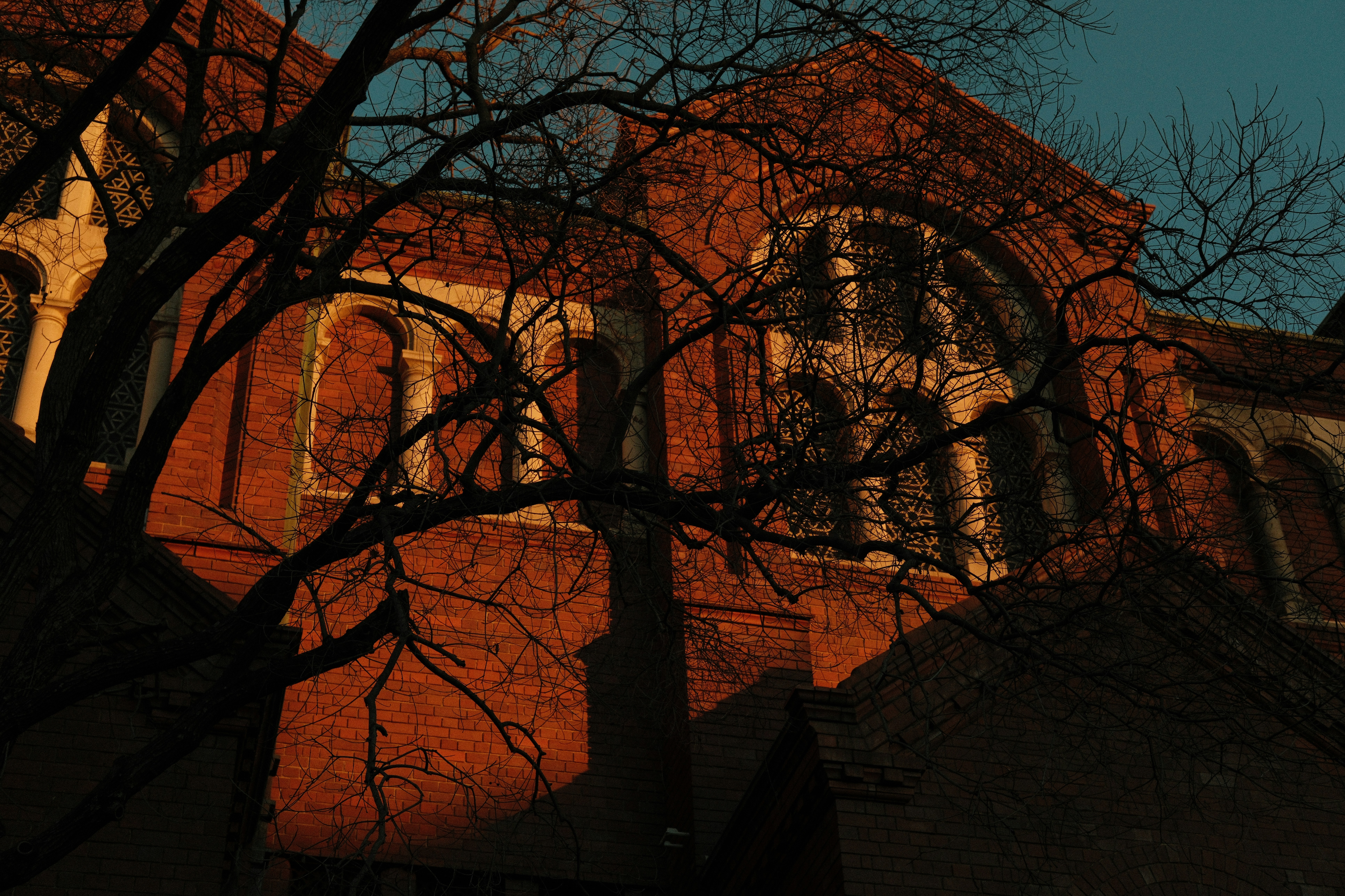 Crimson Brick Gables in Twilight