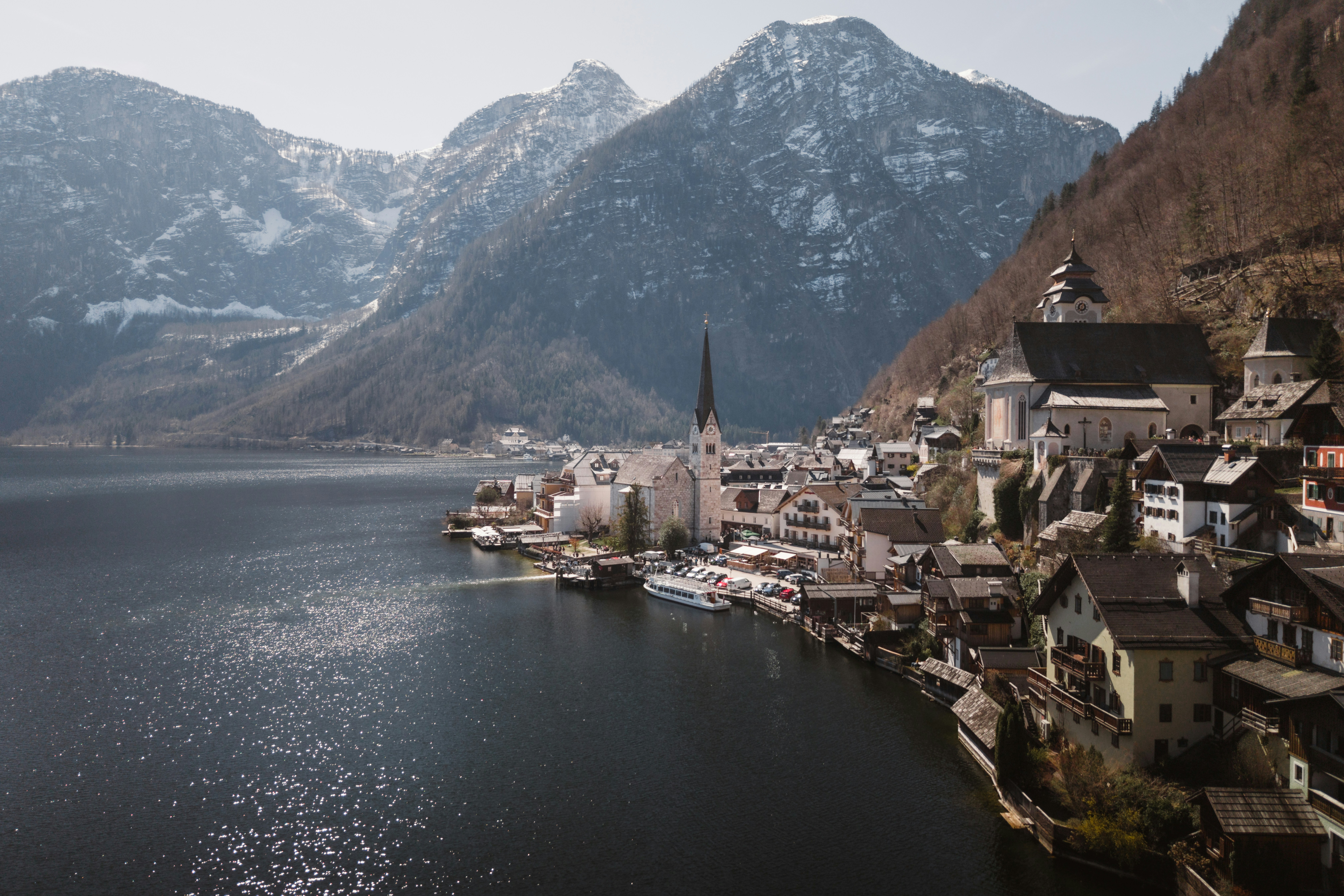 Village by the Fjord: Church Spire Rising Over the Stone Row