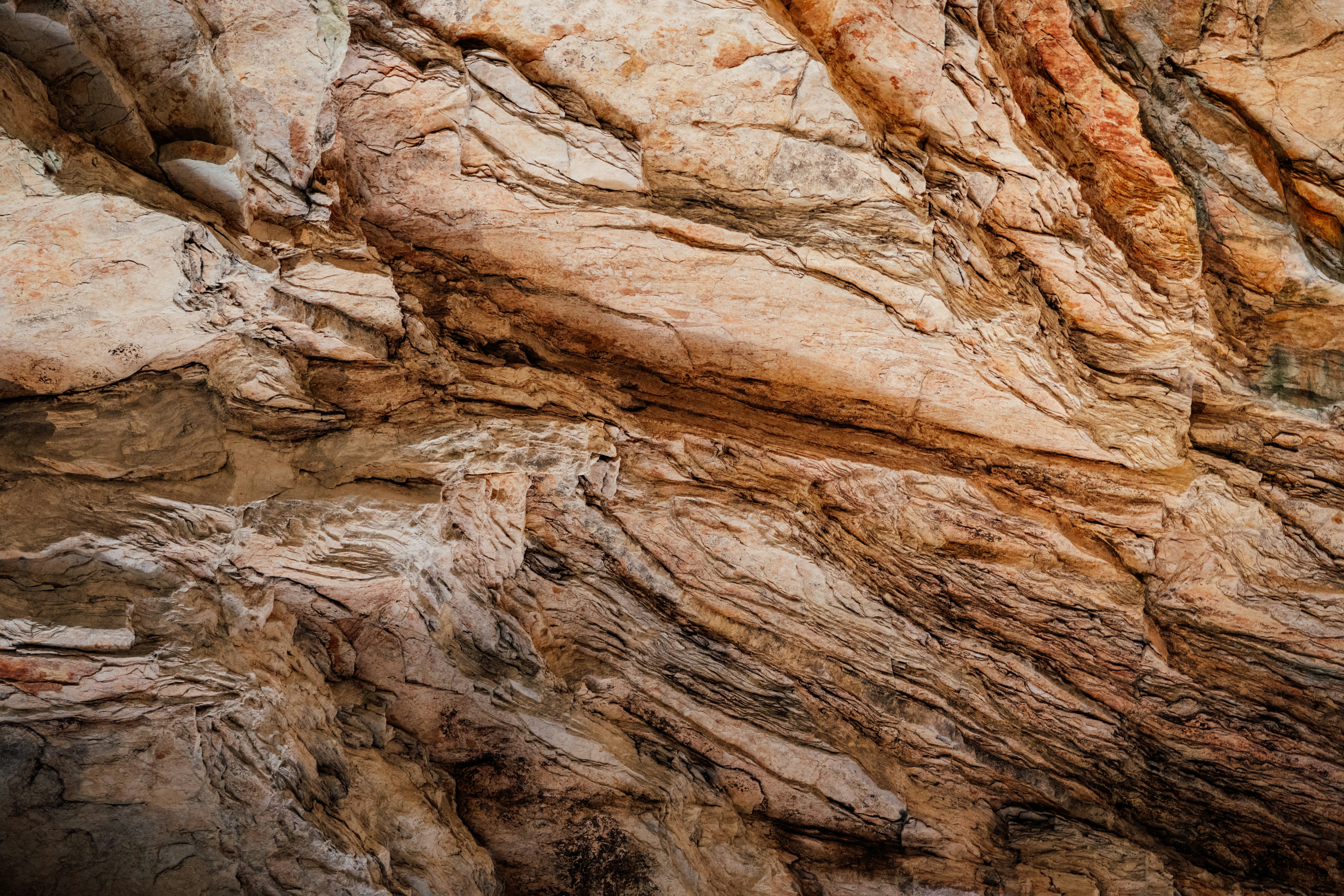 Rugged Strata: Light and Shadow Across Weathered Rock