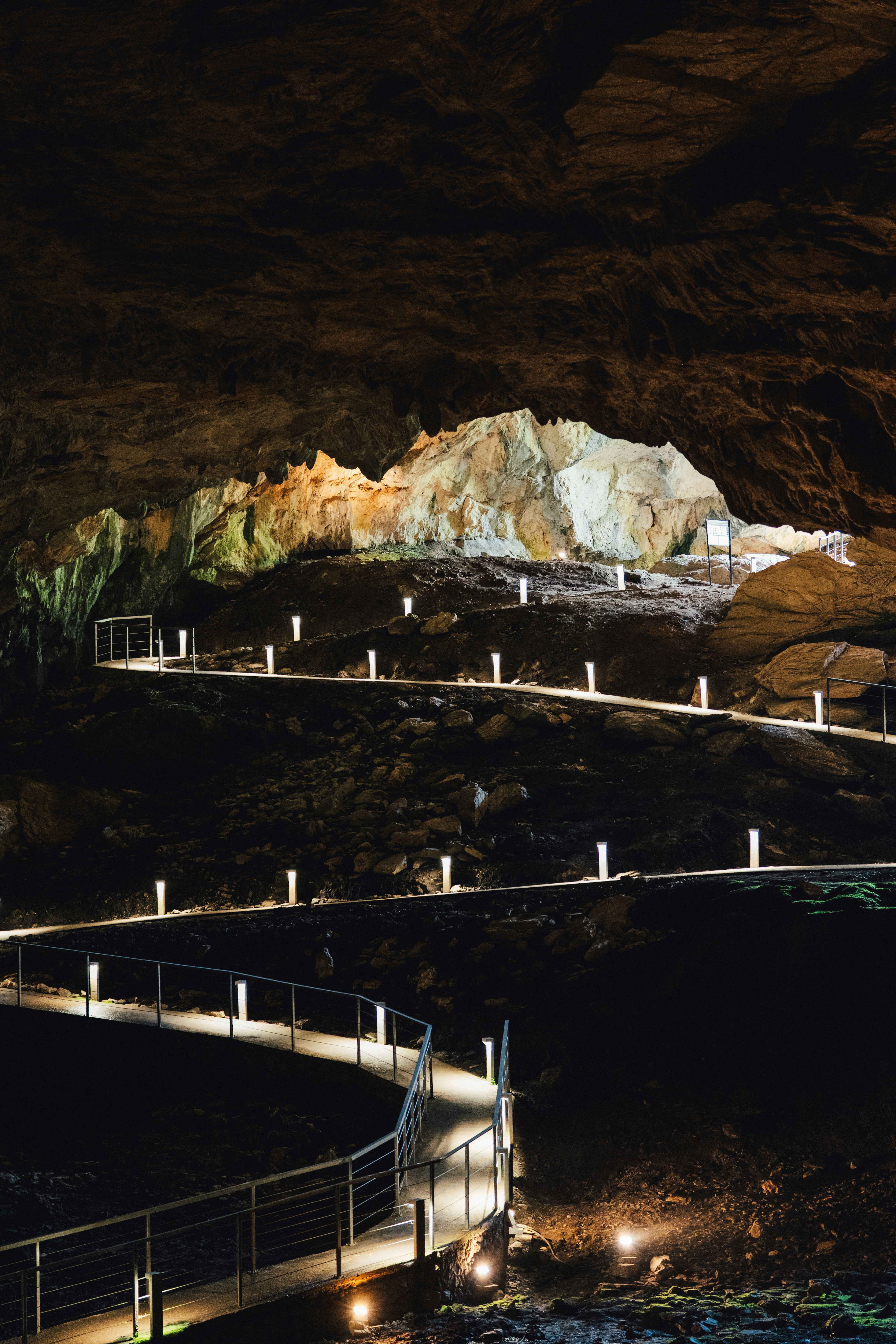 Luminous Path Through the Cavern: A Guided Walk Beneath The Rocks