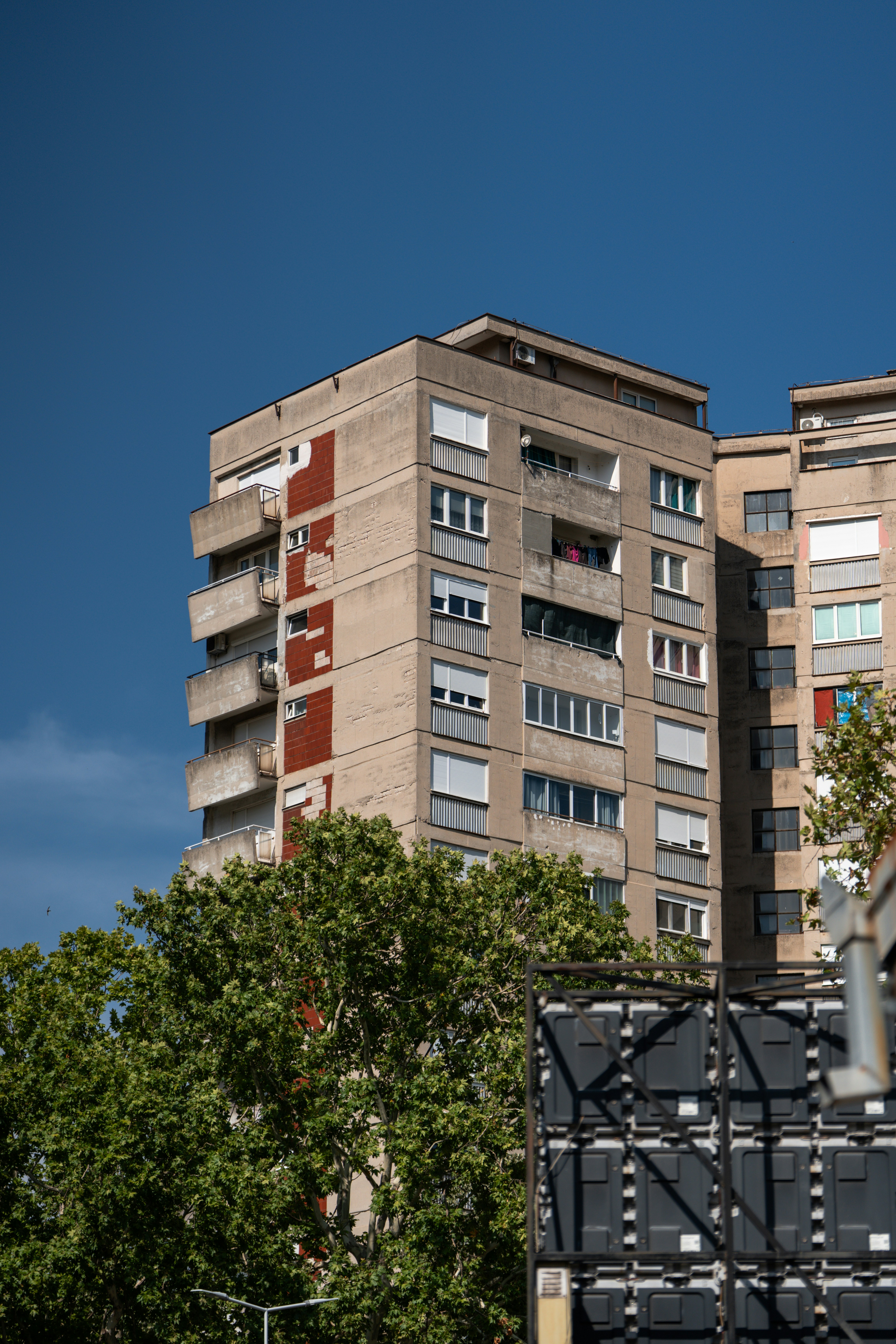 Concrete Heights: Amid the Sky-Blue Gaze at Dusk