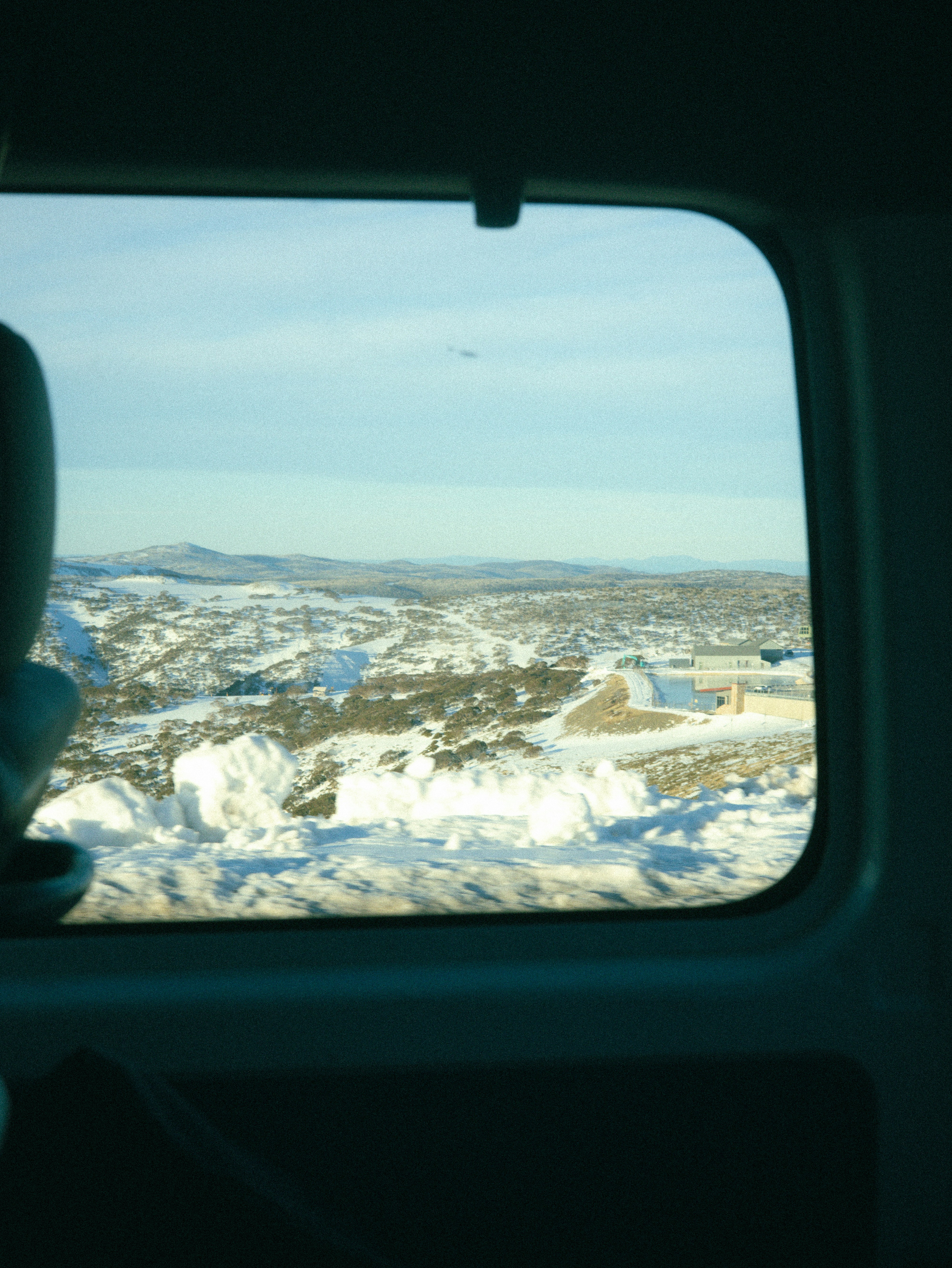 Snowy Horizon Through a Vehicle Window