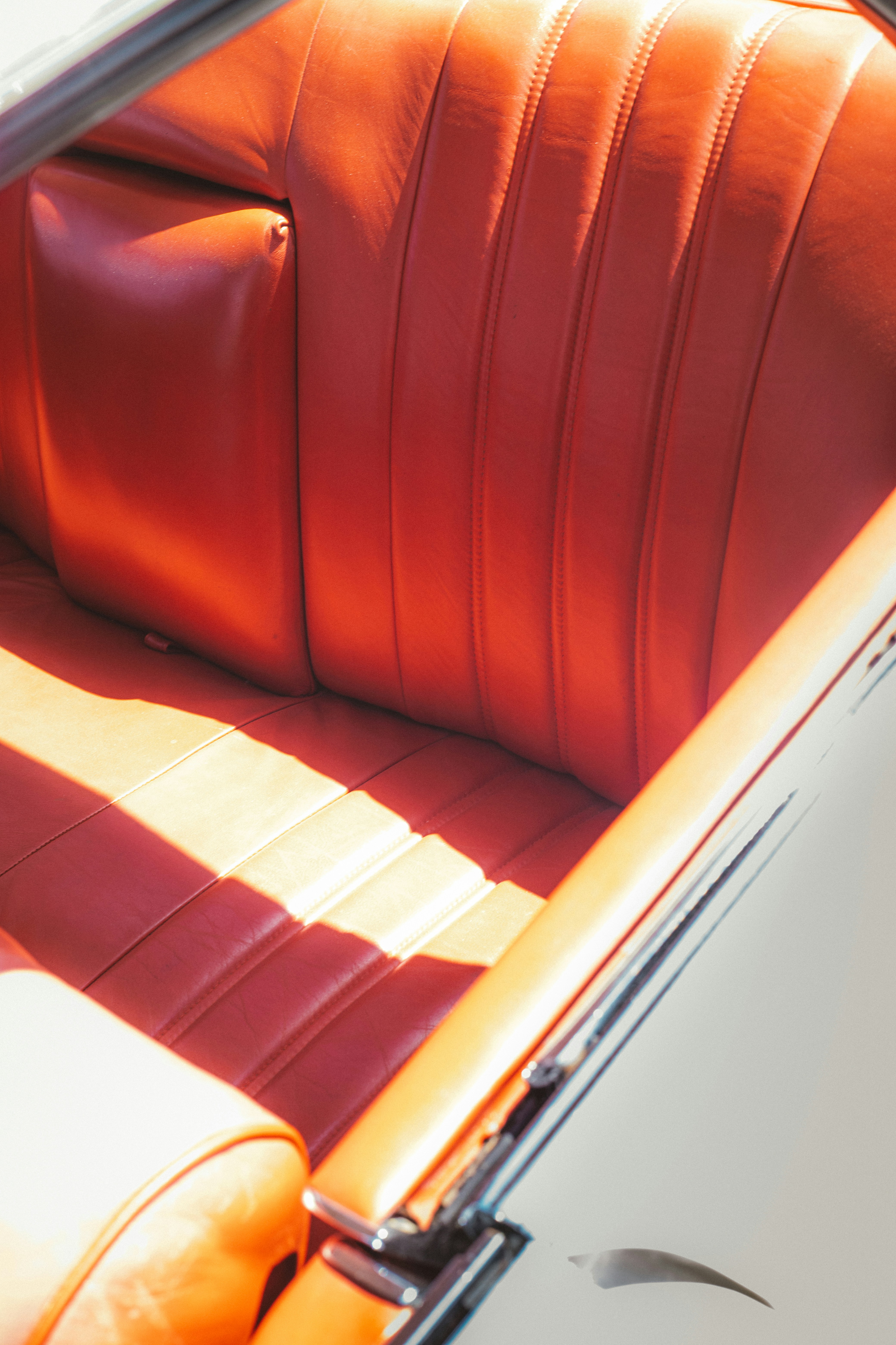 Red Velvet Ribbons: Close-up of Vintage Car Interior Leather