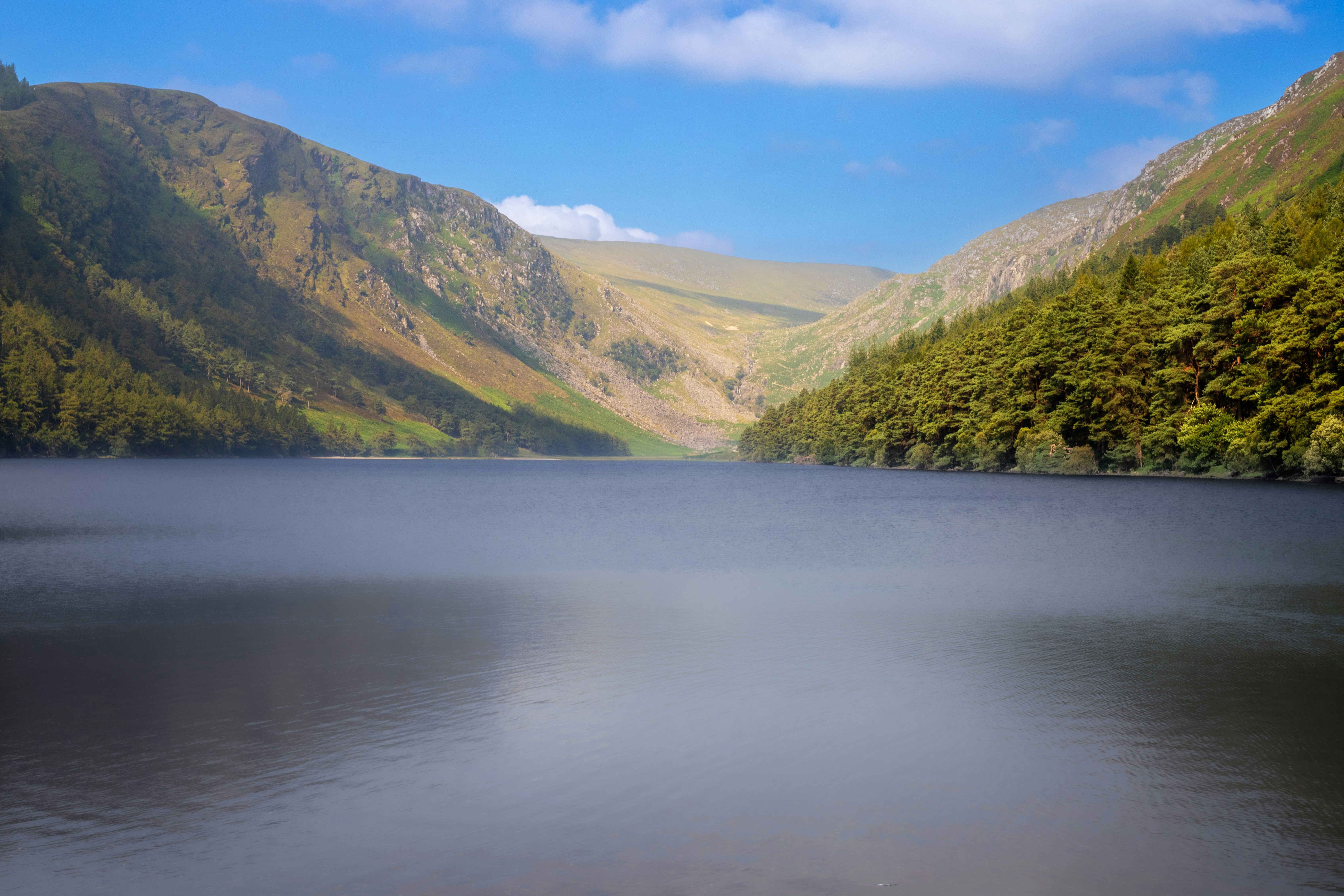 Valley Mirror: A Calm Lake Between Snowy Peaks