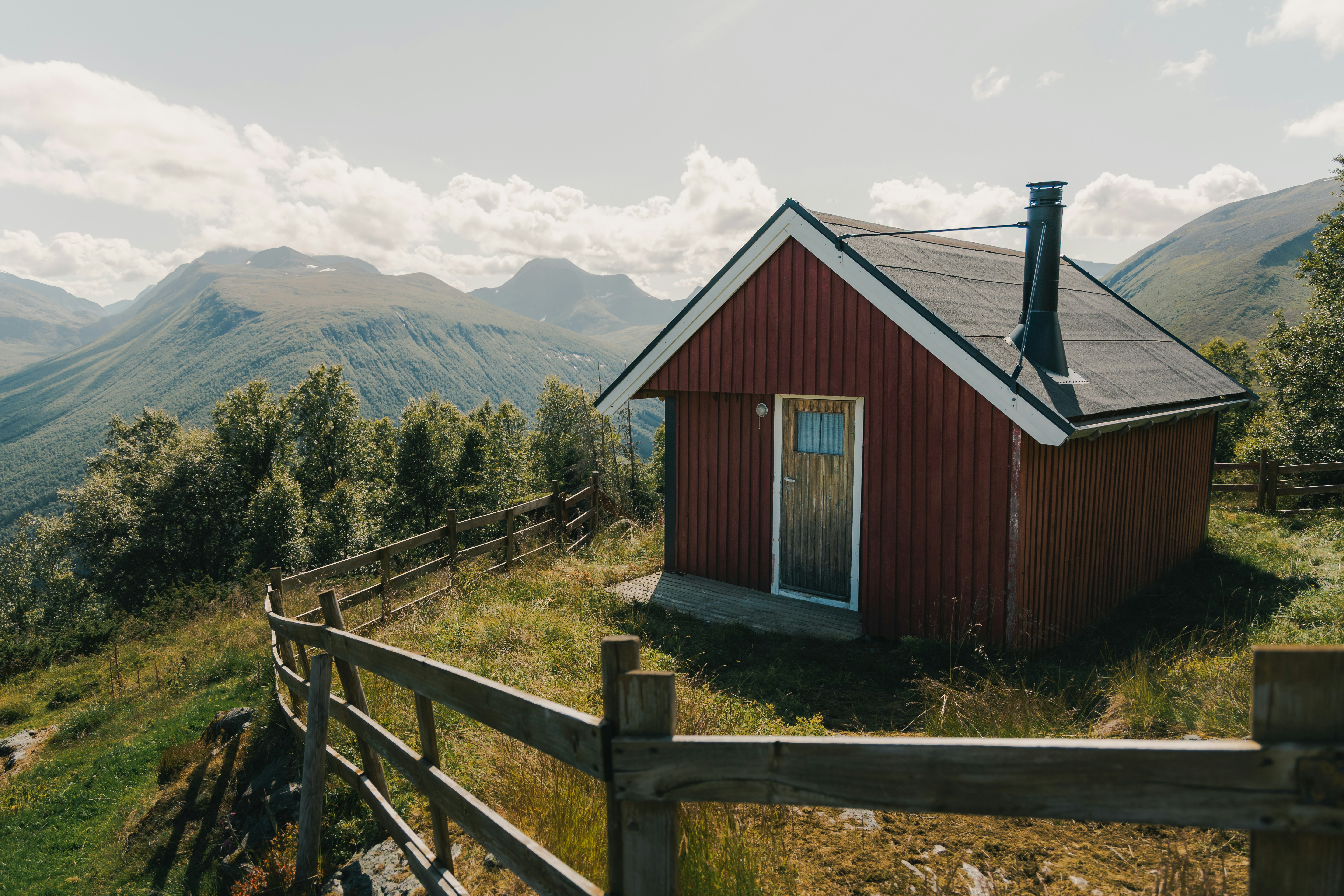 Red Cabin on a Cliff: Quiet Shelter Amid Alpine Vales