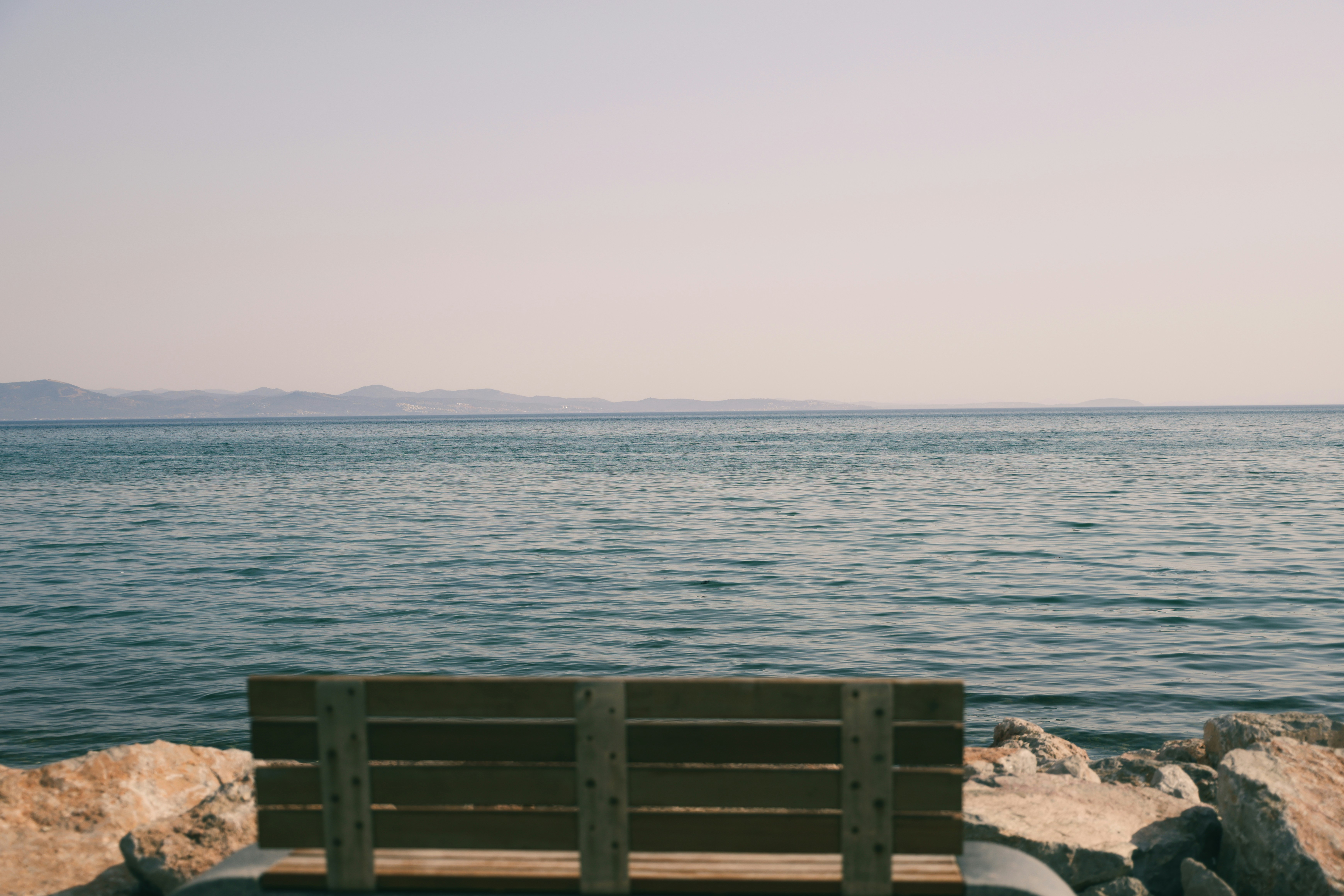 Solitary Bench Overlooking a Quiet Sea