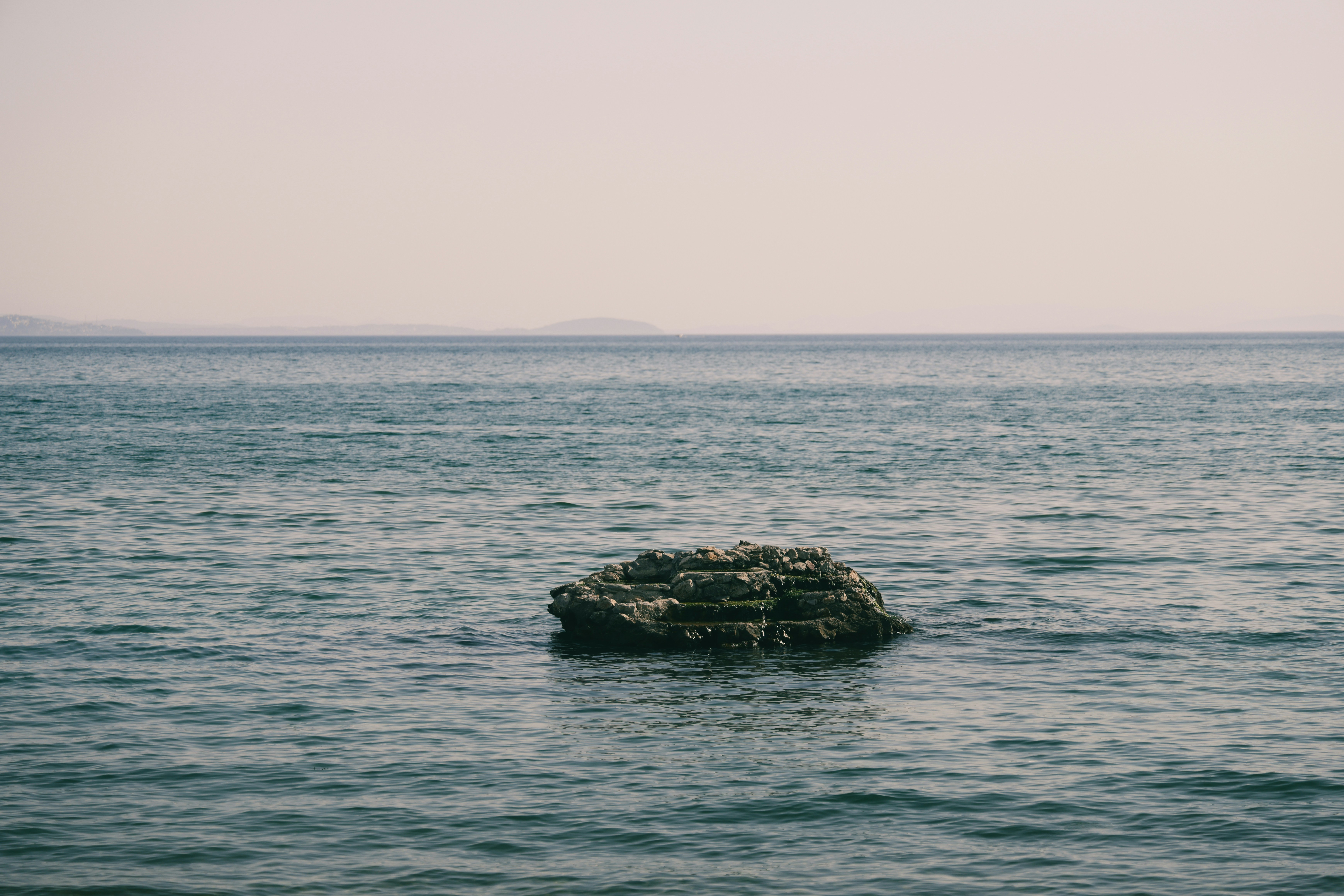 Sea Rock in Quiet Horizon