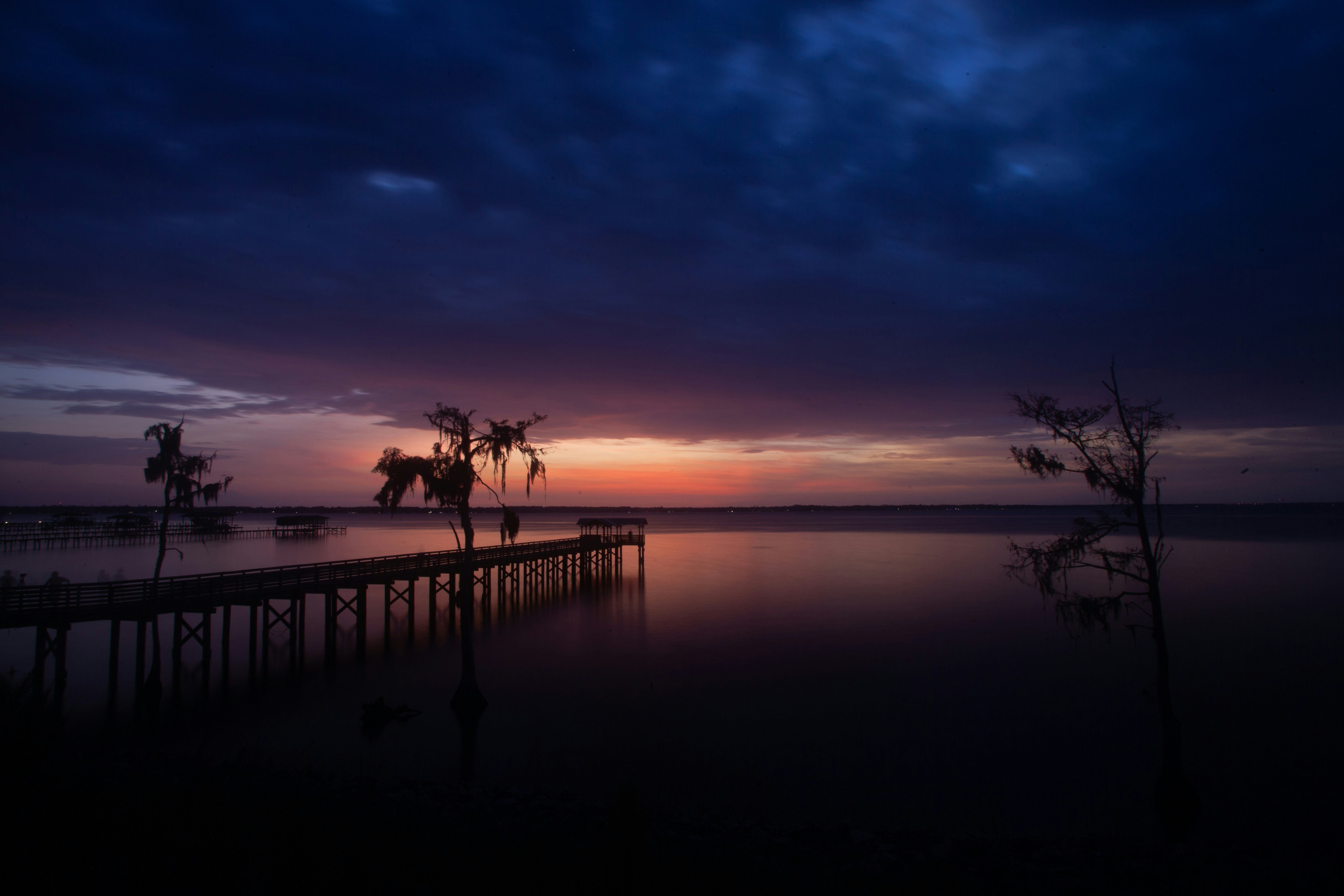 Dusk on the Pier: Silhouettes and Silent Waters