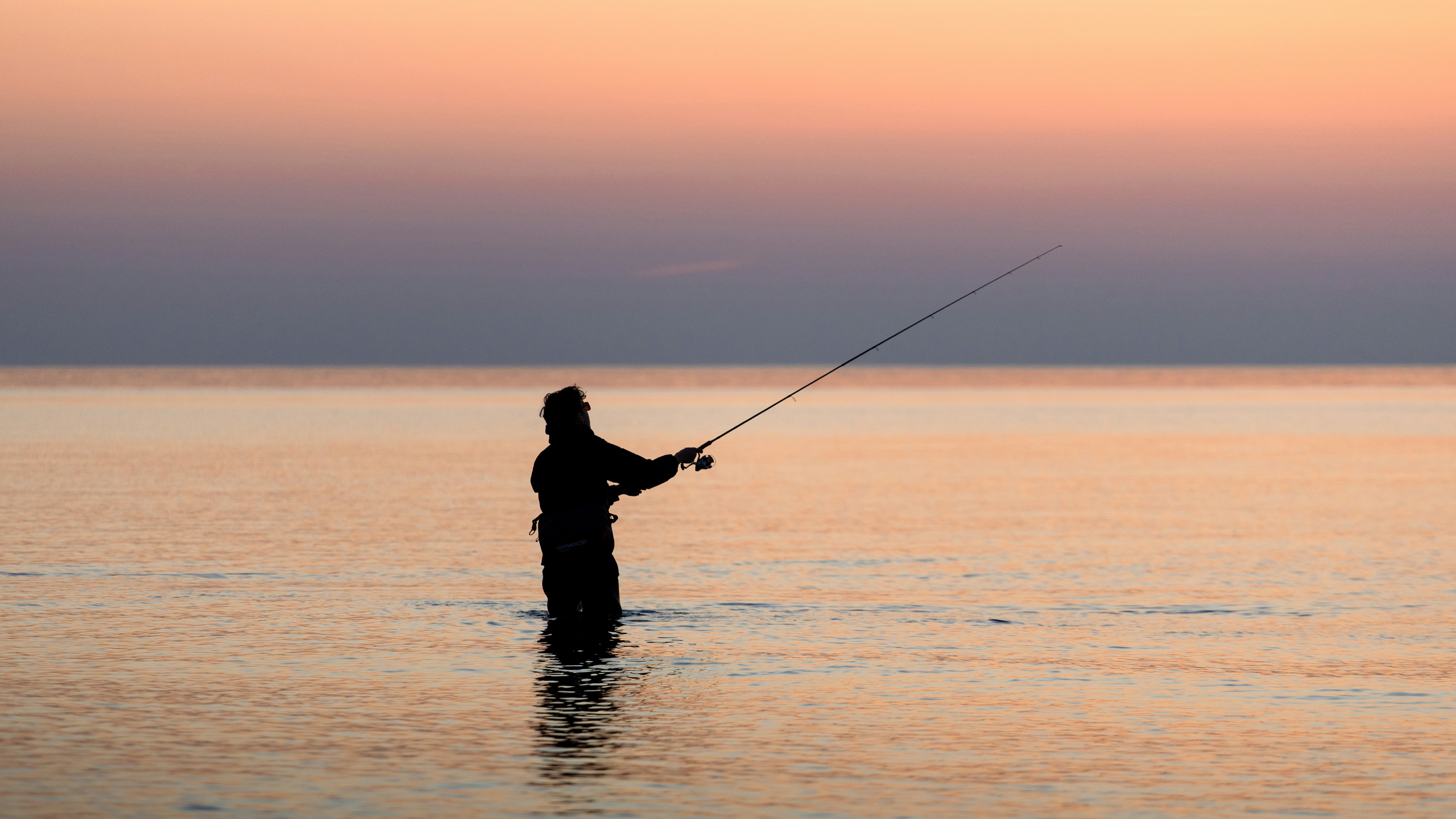 Solitary Angler at Twilight, Casting Toward a Velvet Sea