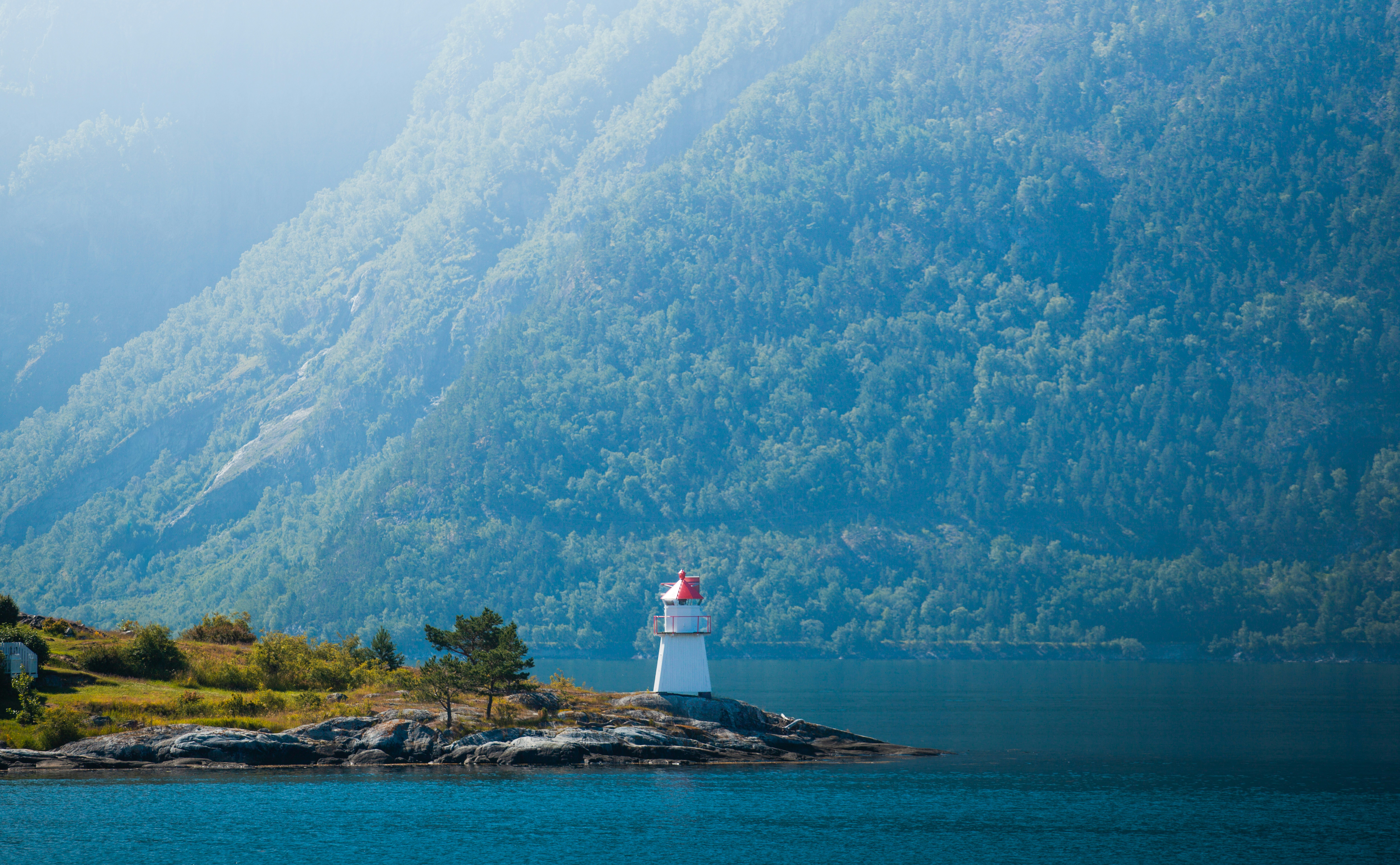 Lighthouse Sentinel on a Quiet Fjord