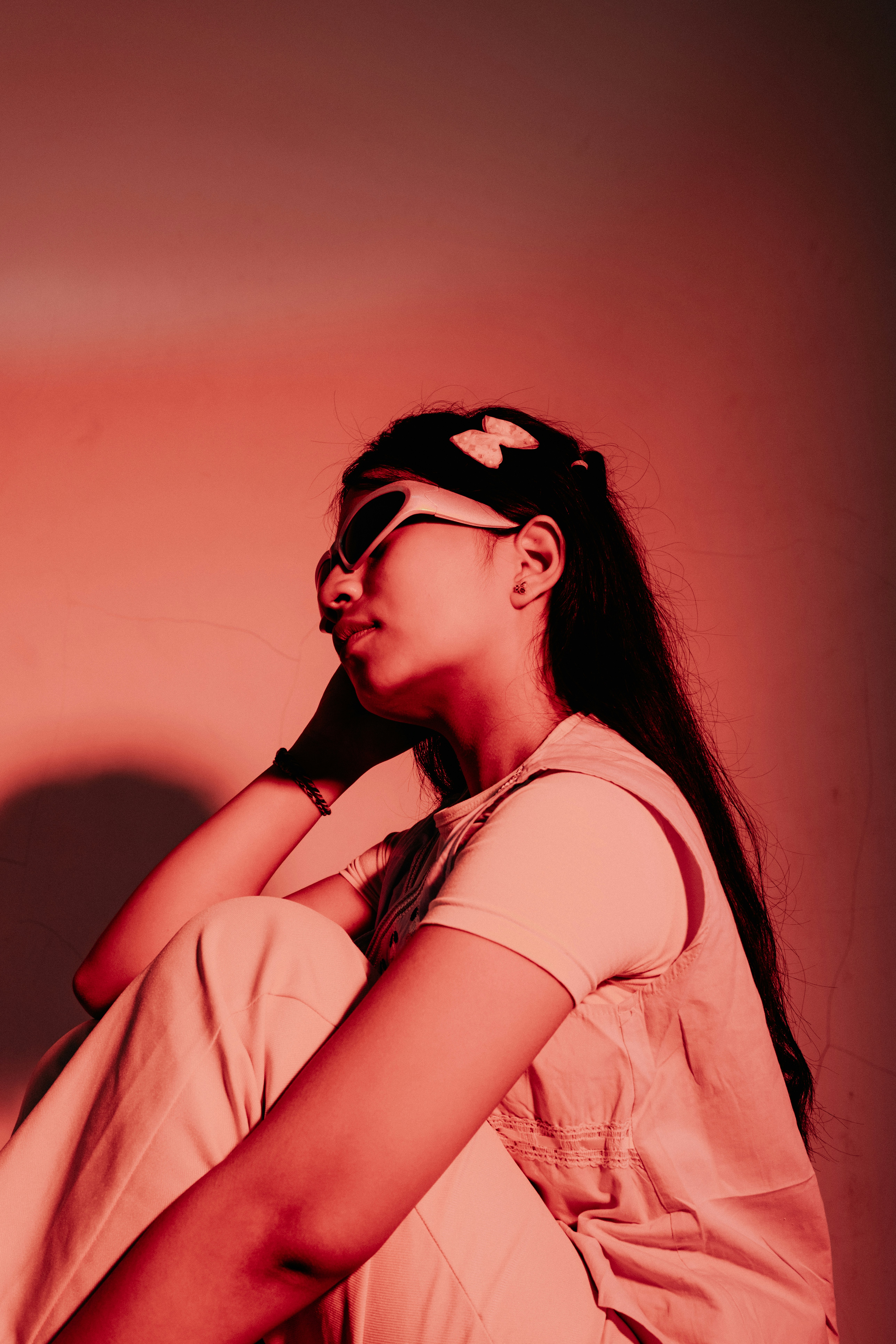Neon Quiet: A Side Profile in Red Light