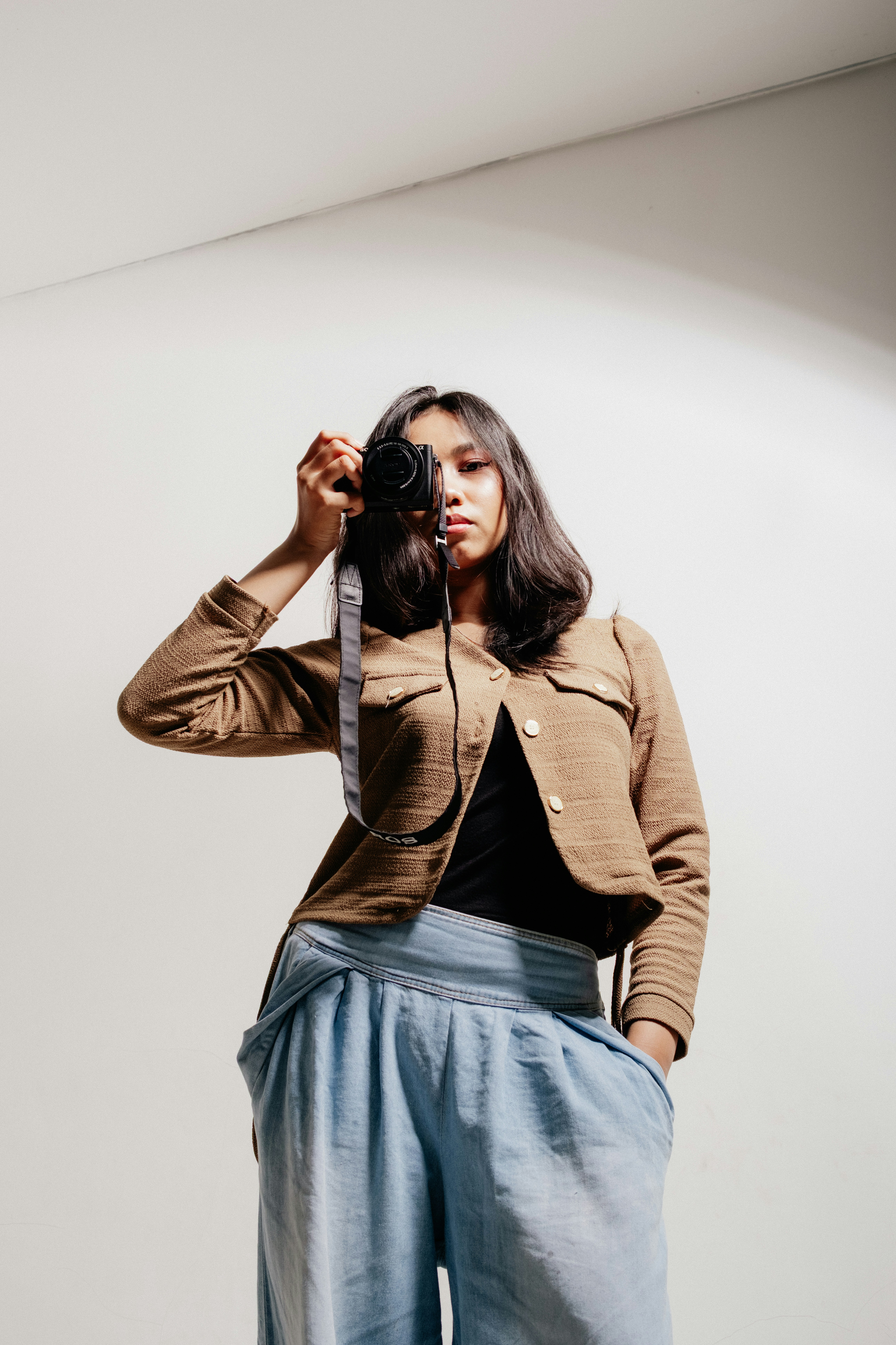 Behind the Lens: A Confident Moment in Minimal Studio Light