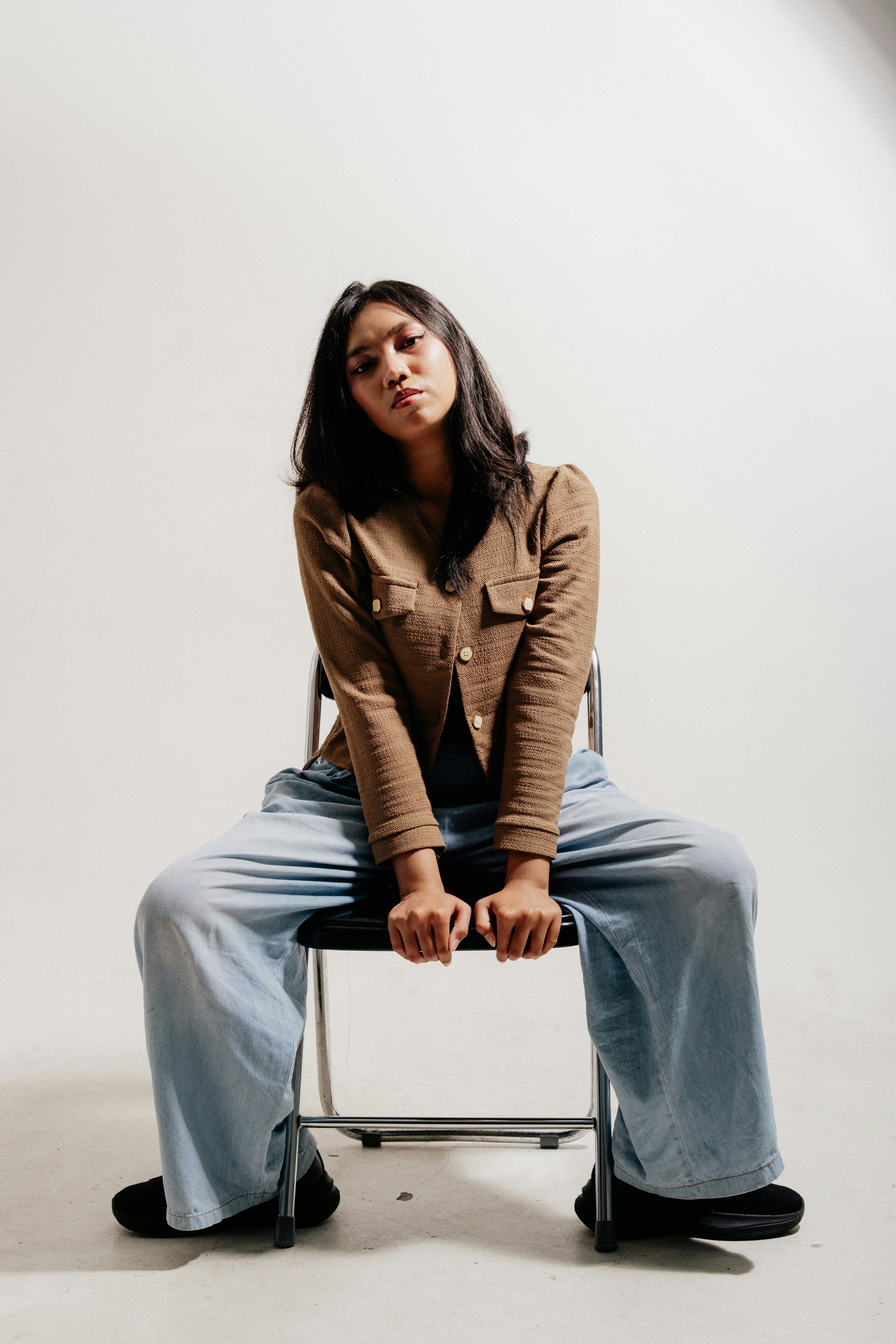 Centered Calm: A Seated Portrait in Soft Studio Light