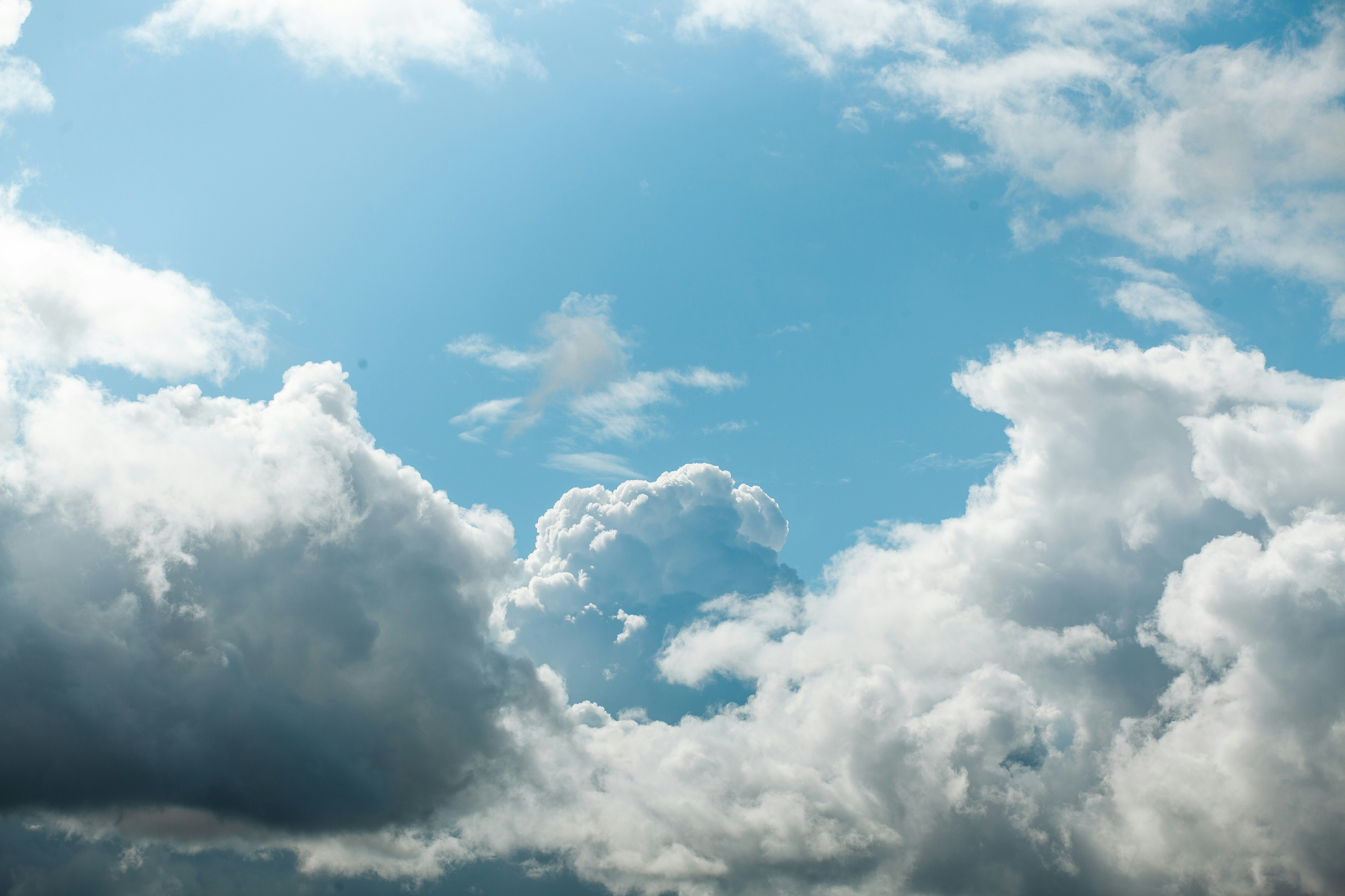 Azure Break: Sunlit Cumulus Over a Quiet Sky
