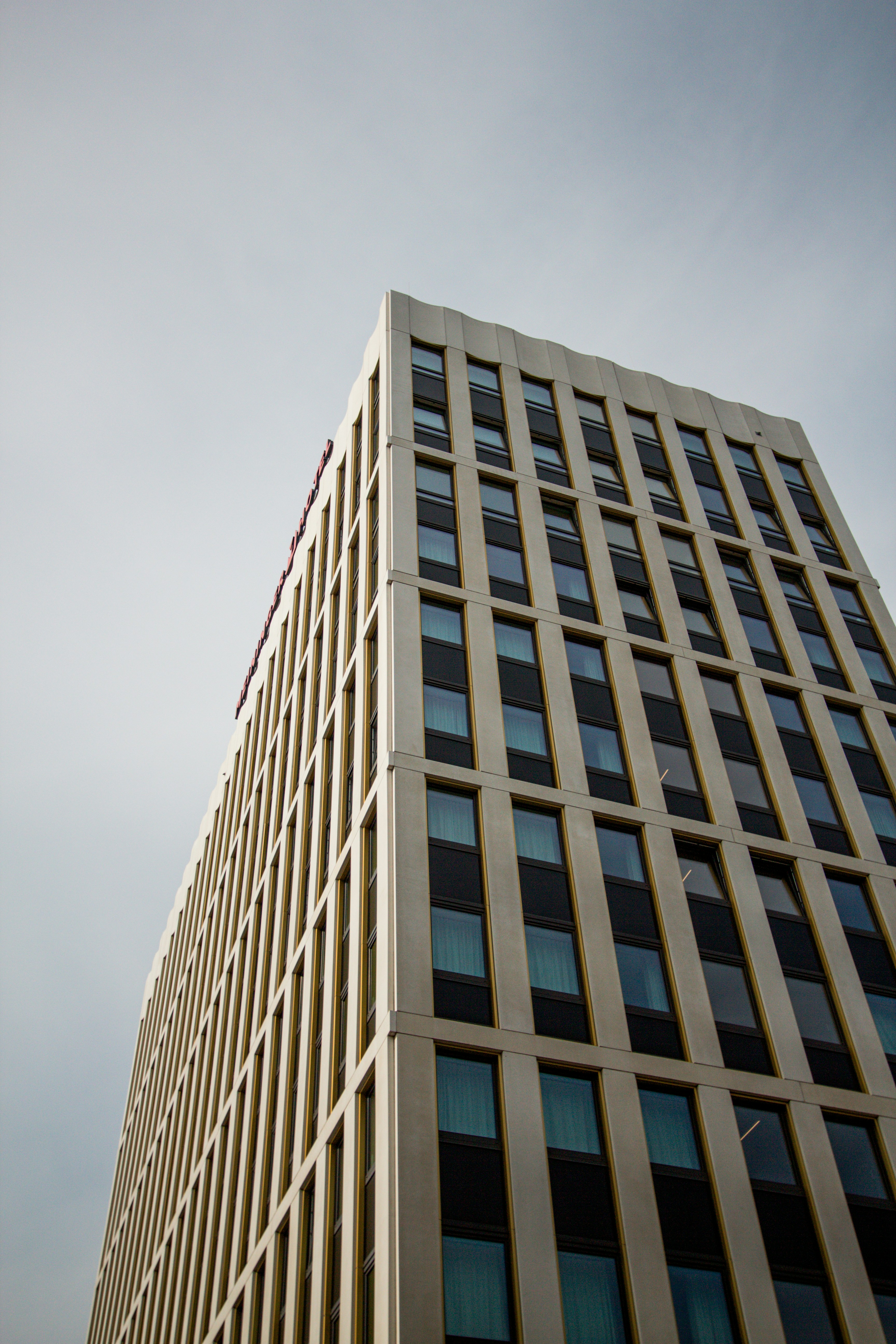 Skyward Facade: A diagonal ascent through a glass-and-concrete tower