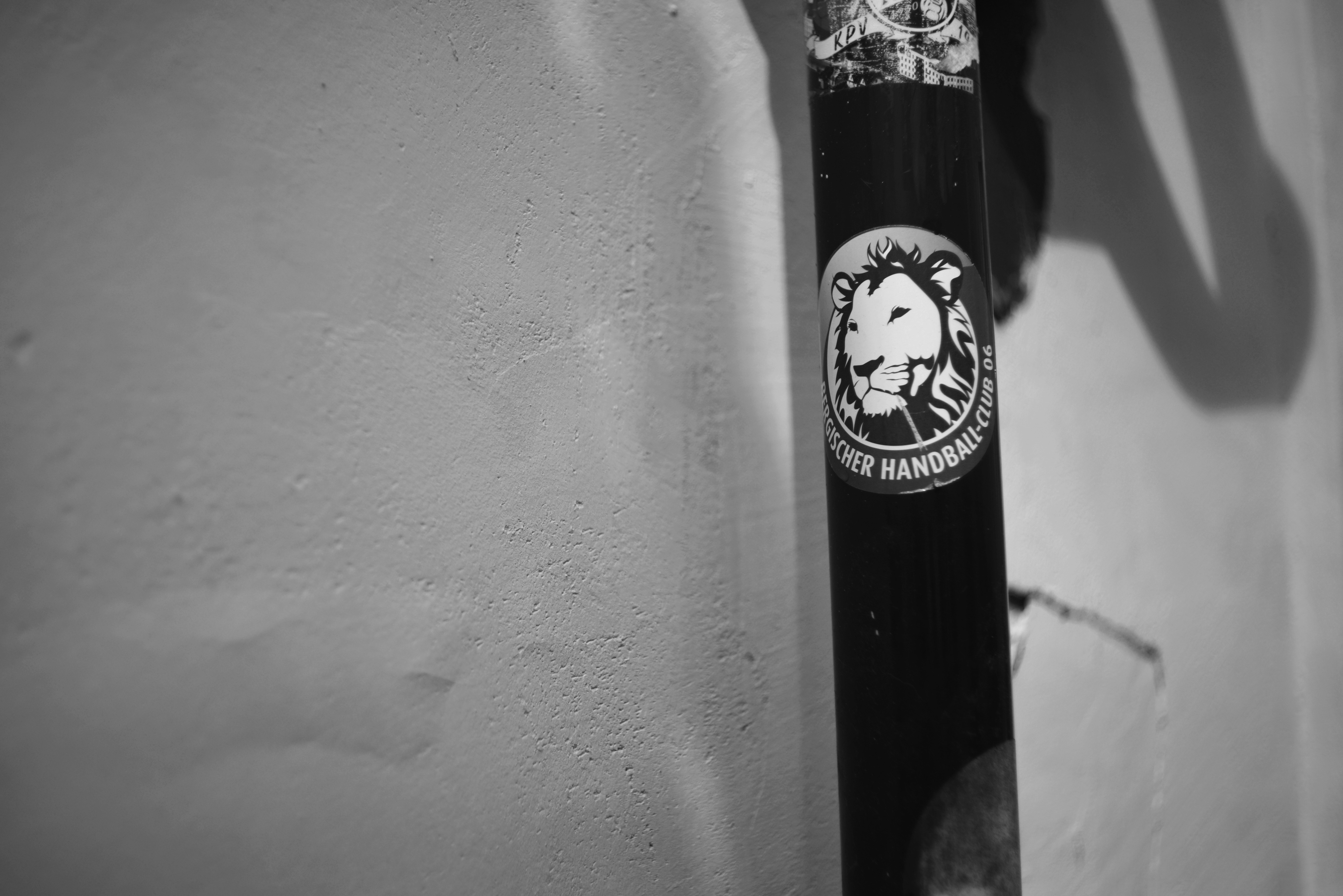 Locker Tag on a Handball Stick: A Quiet Black-and-White Moment