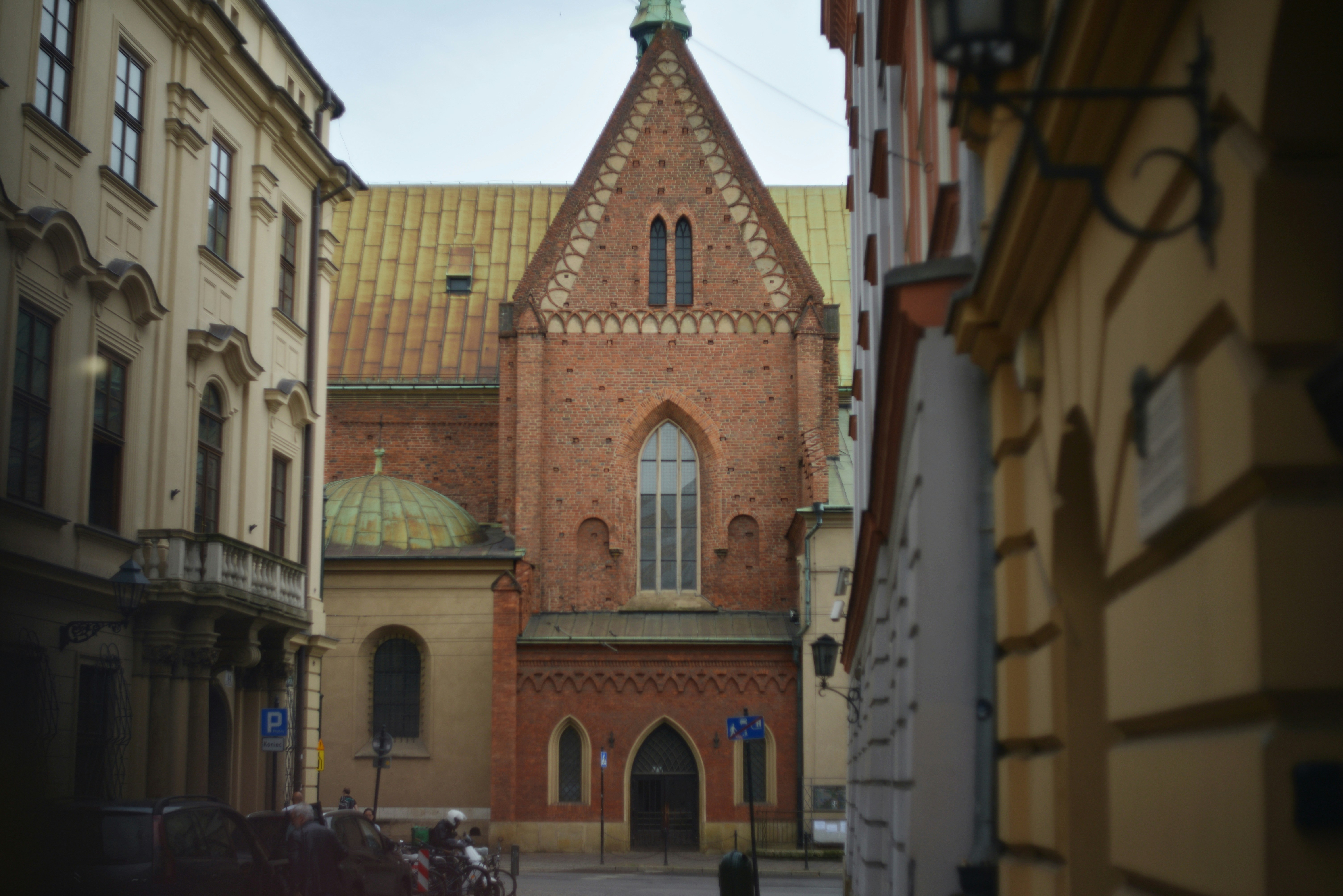 Brick Gothic Portal Framed by Narrow Street