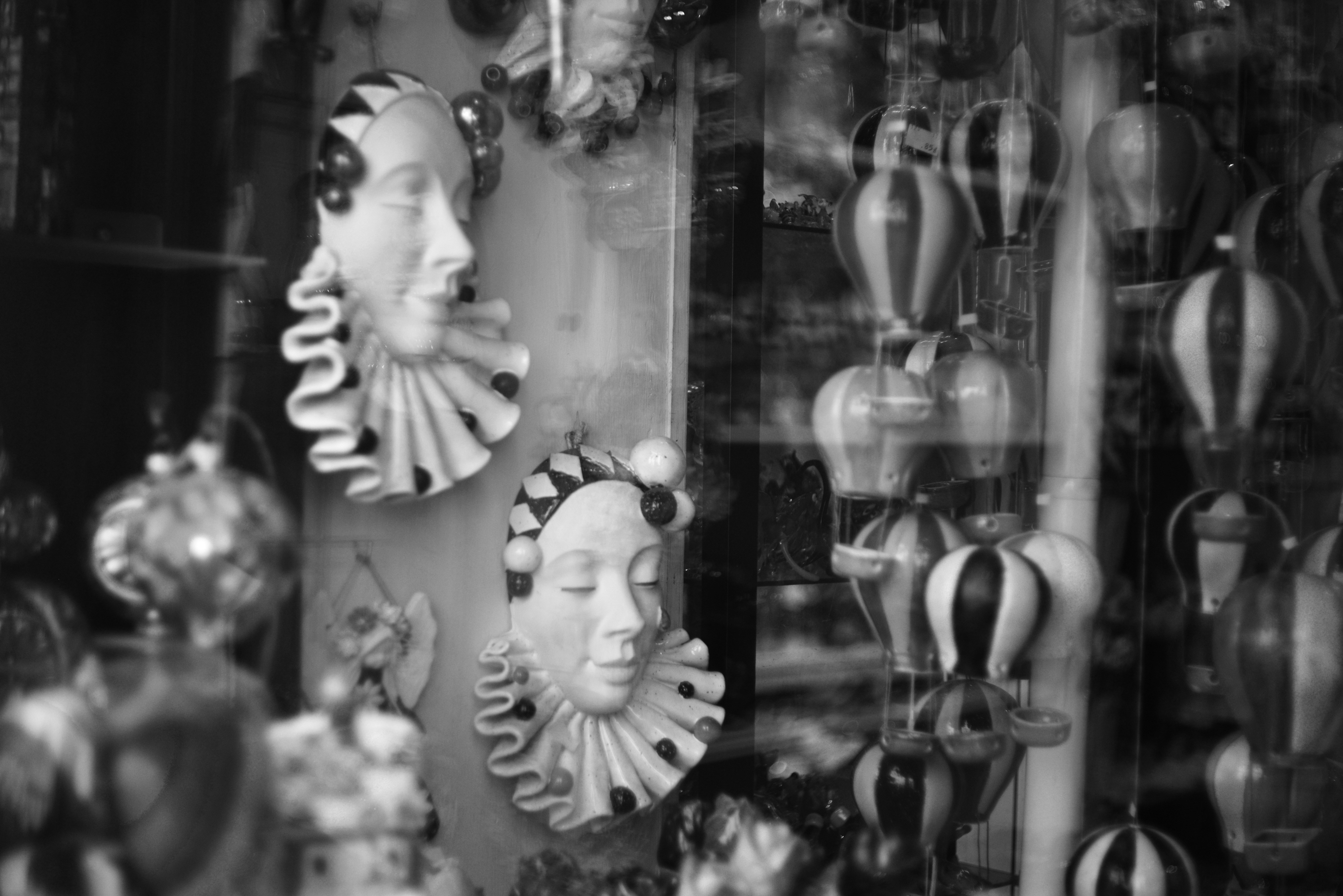 Echoes in Glass: Masks and Orbs in a Window of Quiet Reflections