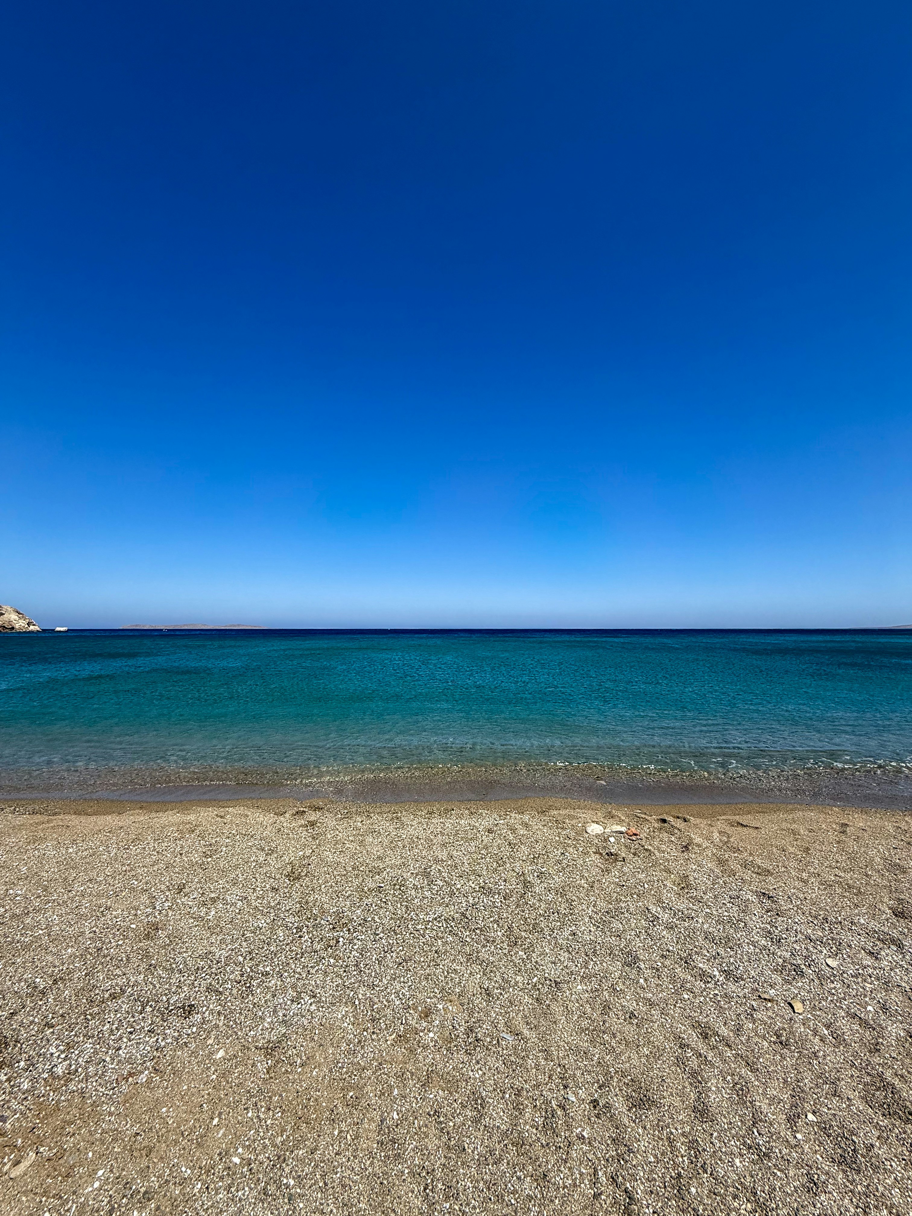 Azure Horizon Over Quiet Sands