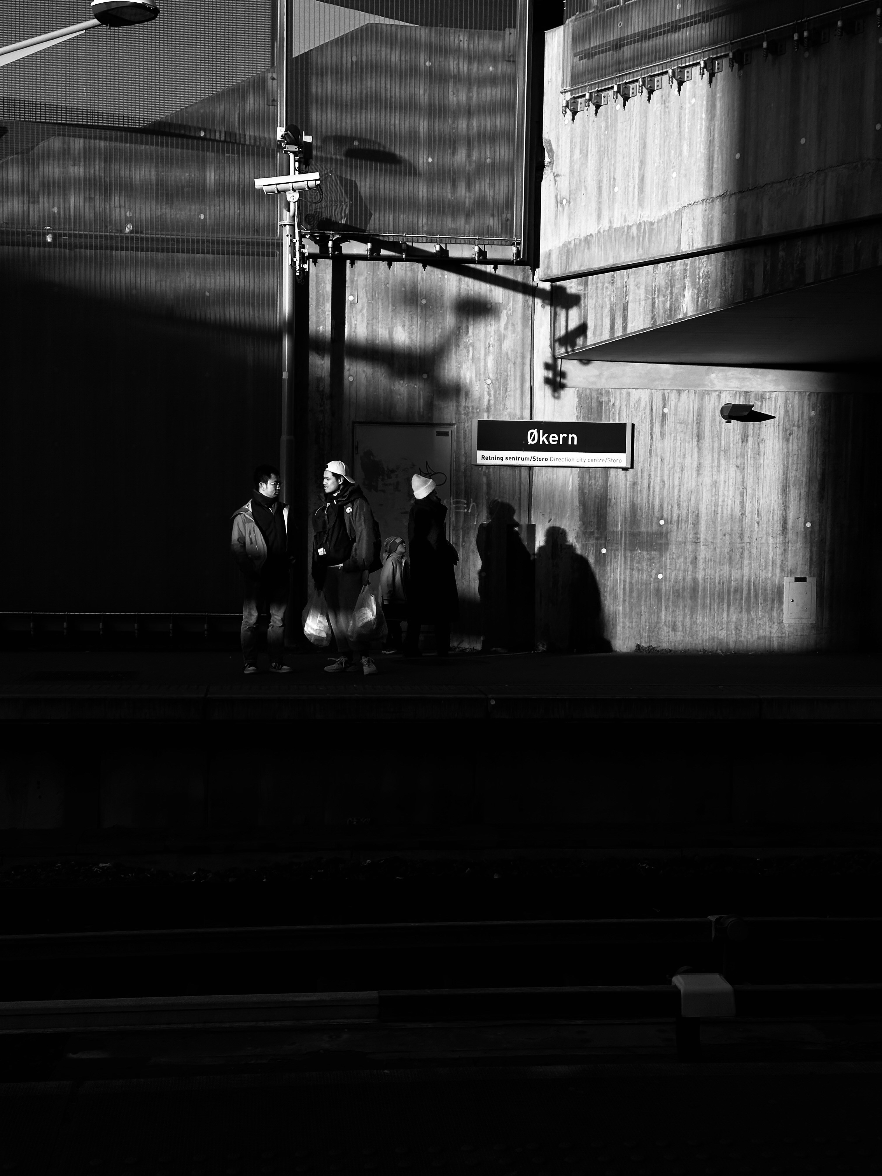 Shadows on the Platform: A Quiet Stairwell of Silence