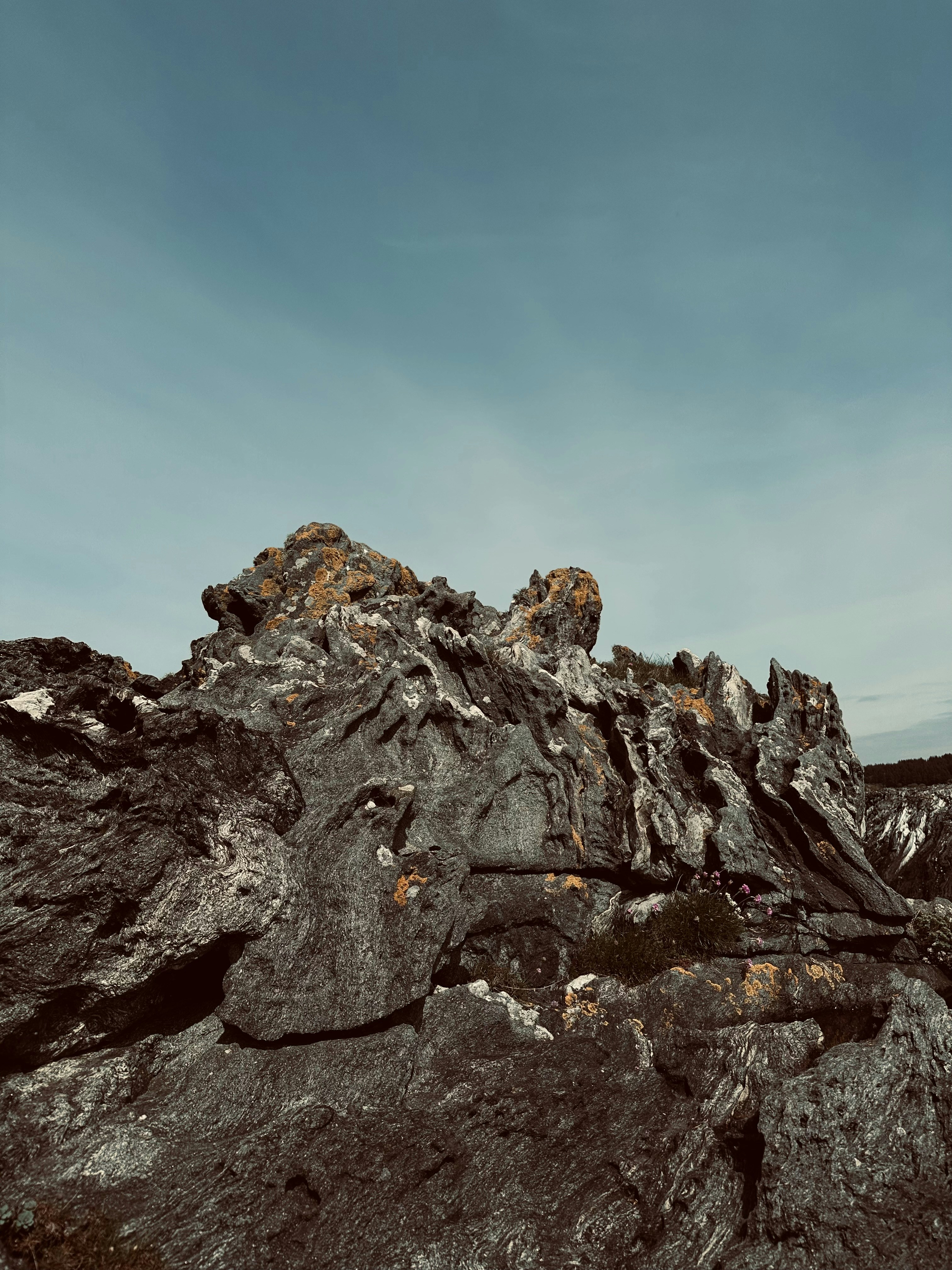 Granite Crown: Rugged lava forms under a clear sky