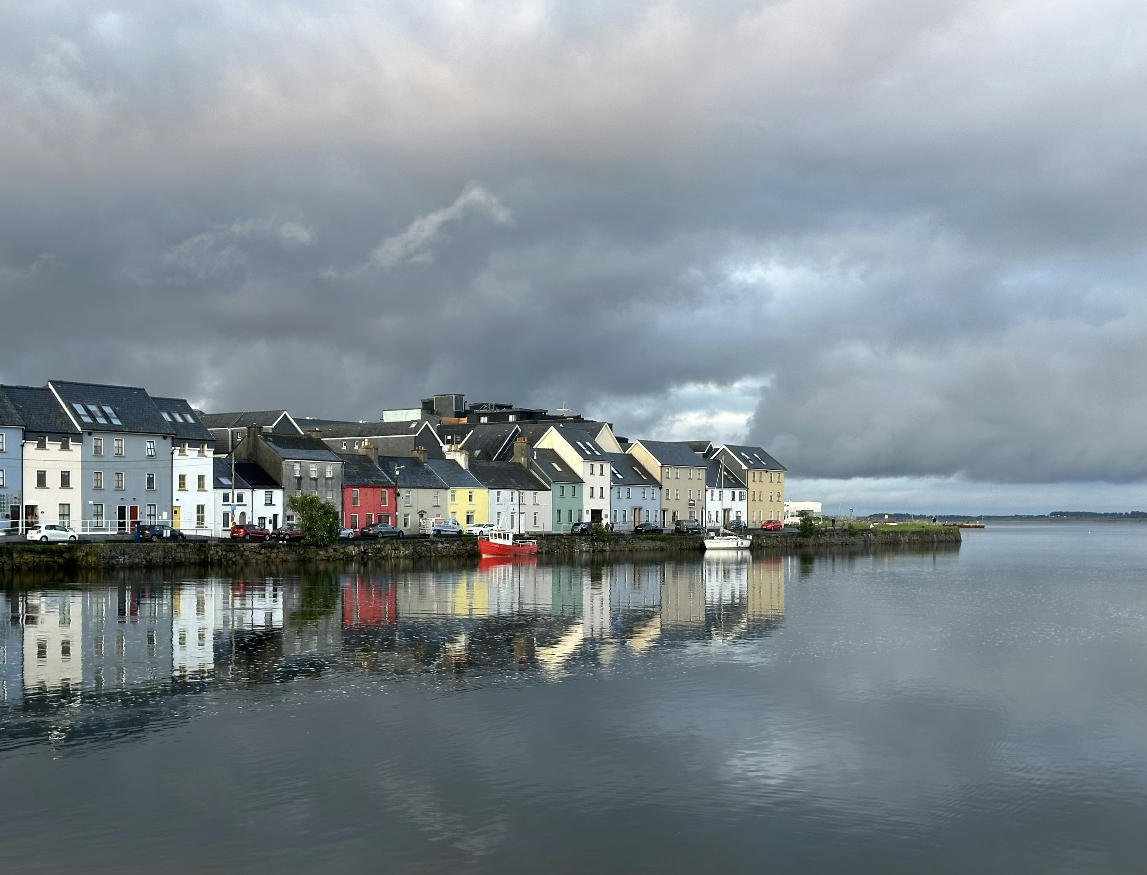 Quaint Coastal Row of Seaside Homes Reflecting on Quiet Waters