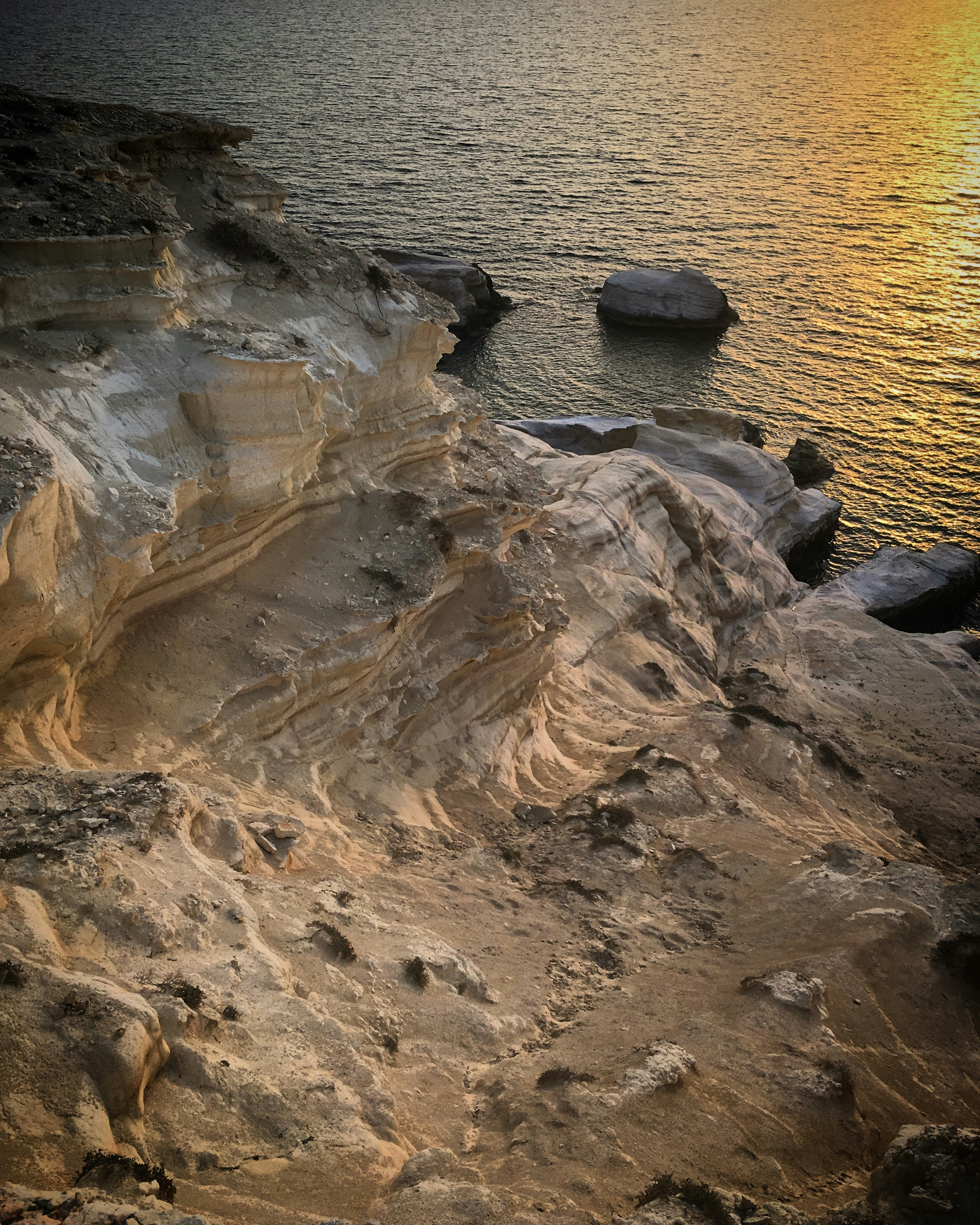 Sunlit Limestone Steps Beside a Quiet Sea