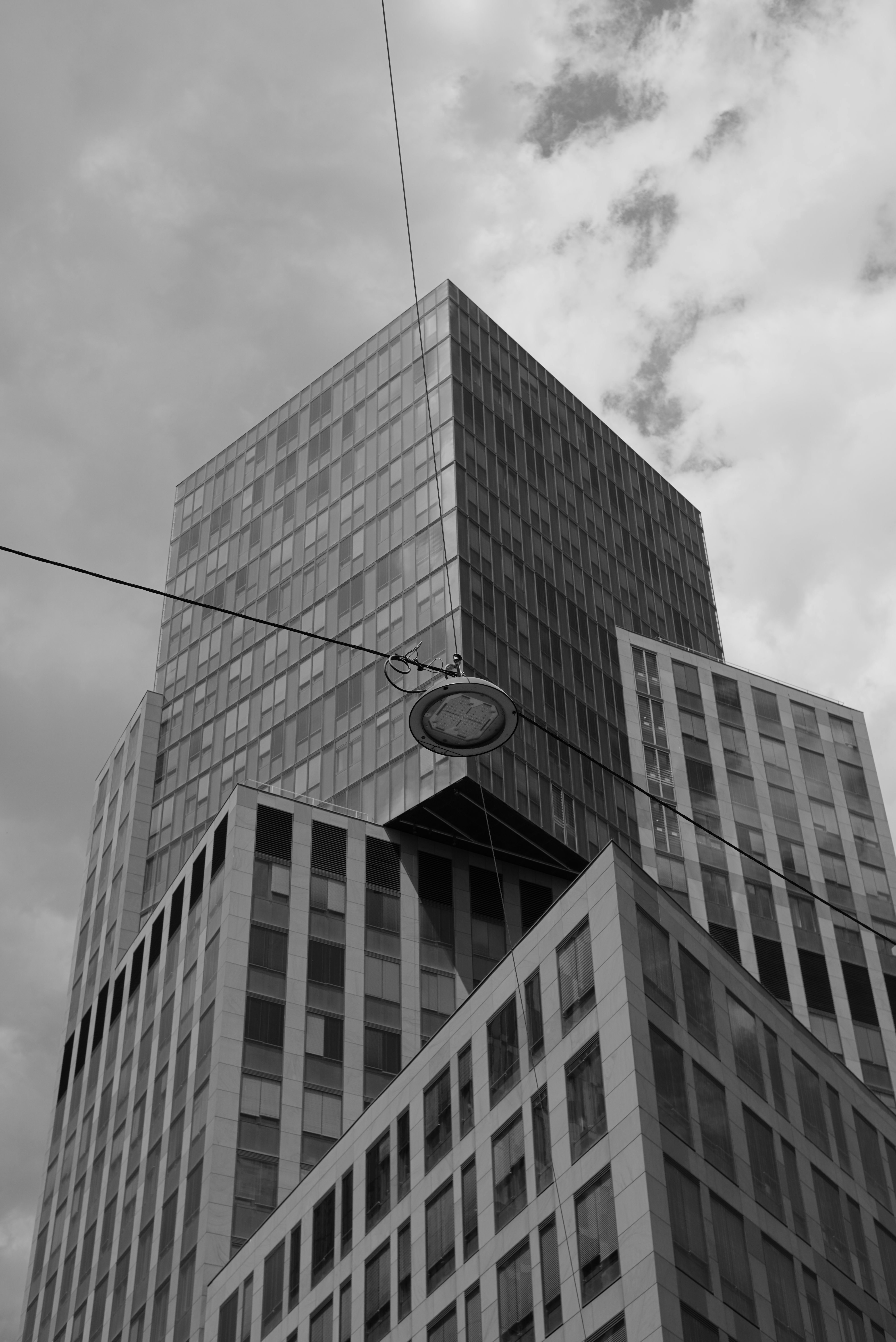 Urban Monolith: A Suspended Lantern Between Skyscrapers