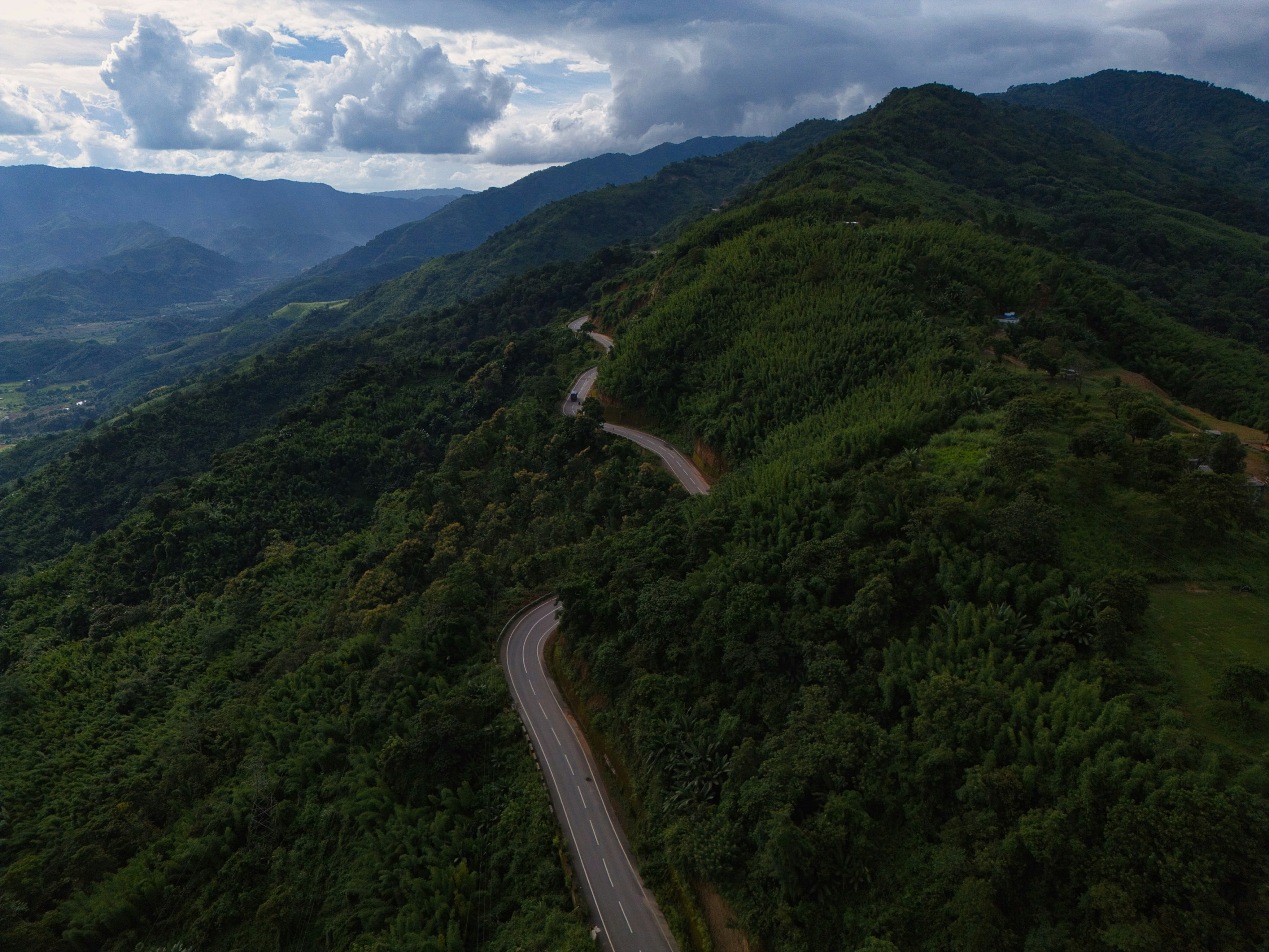 Serpentine Ridge: A Winding Ascent Through Misty Green Peaks
